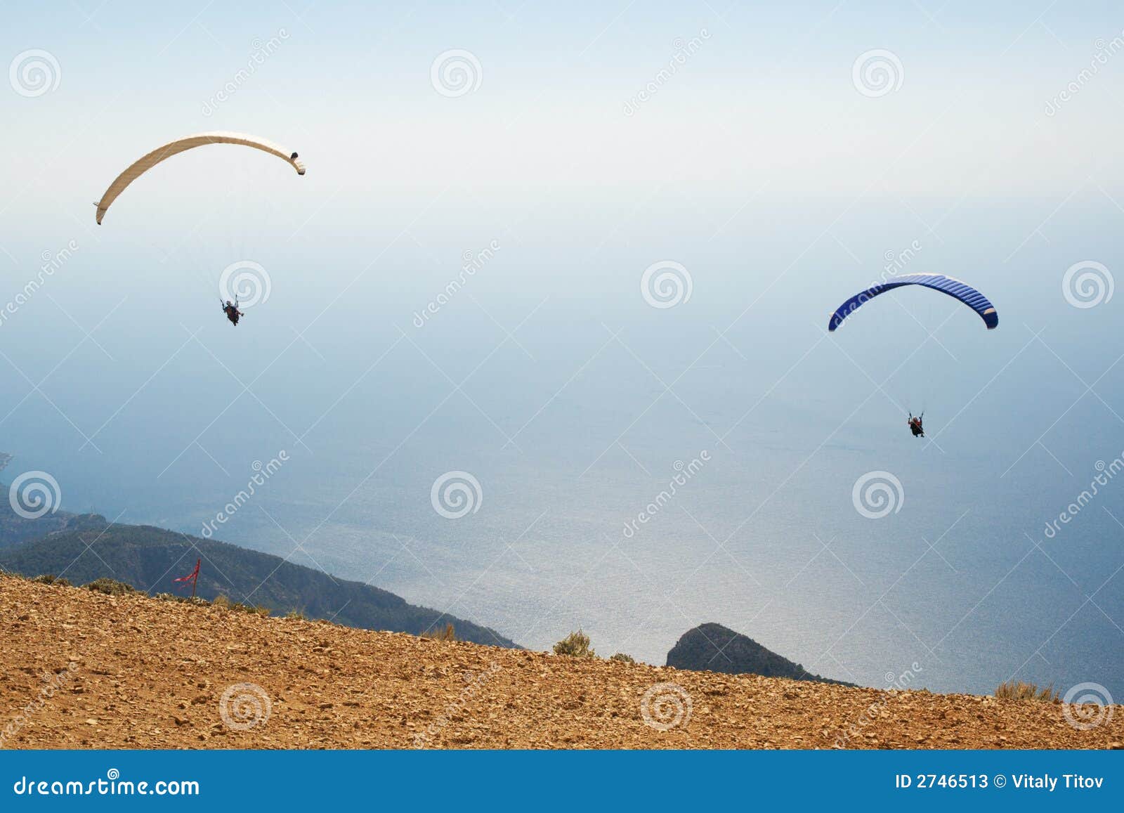 Two parachutes in the sky stock image. Image of landscape - 2746513