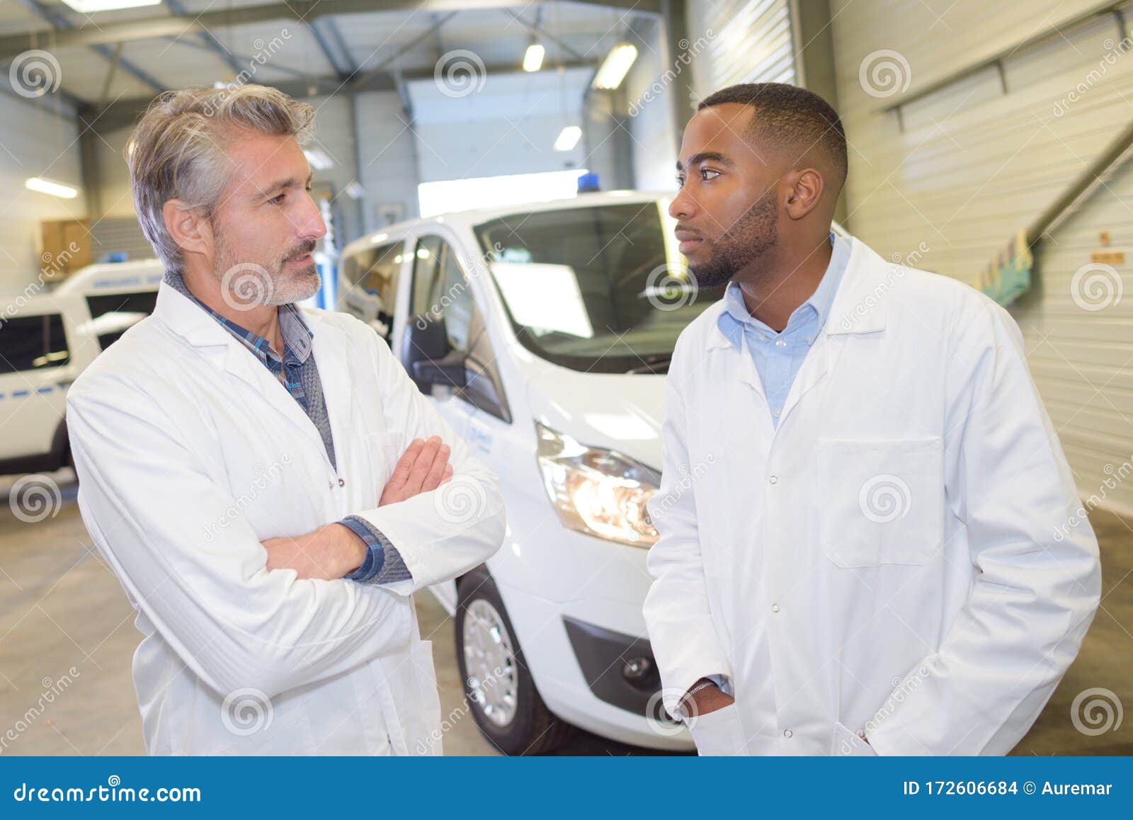 Two Paramedics Talking Outside Ambulance Stock Photo - Image of ...