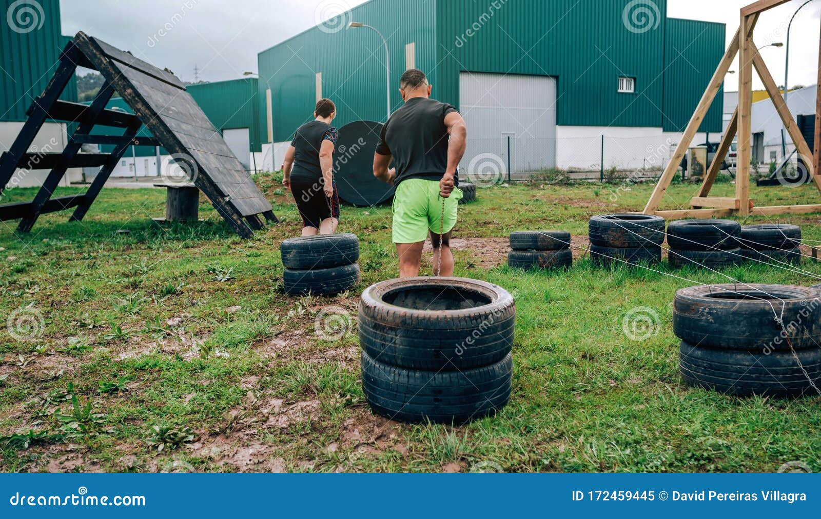 Participants in an Obstacle Course Dragging Wheels Stock Image - Image ...