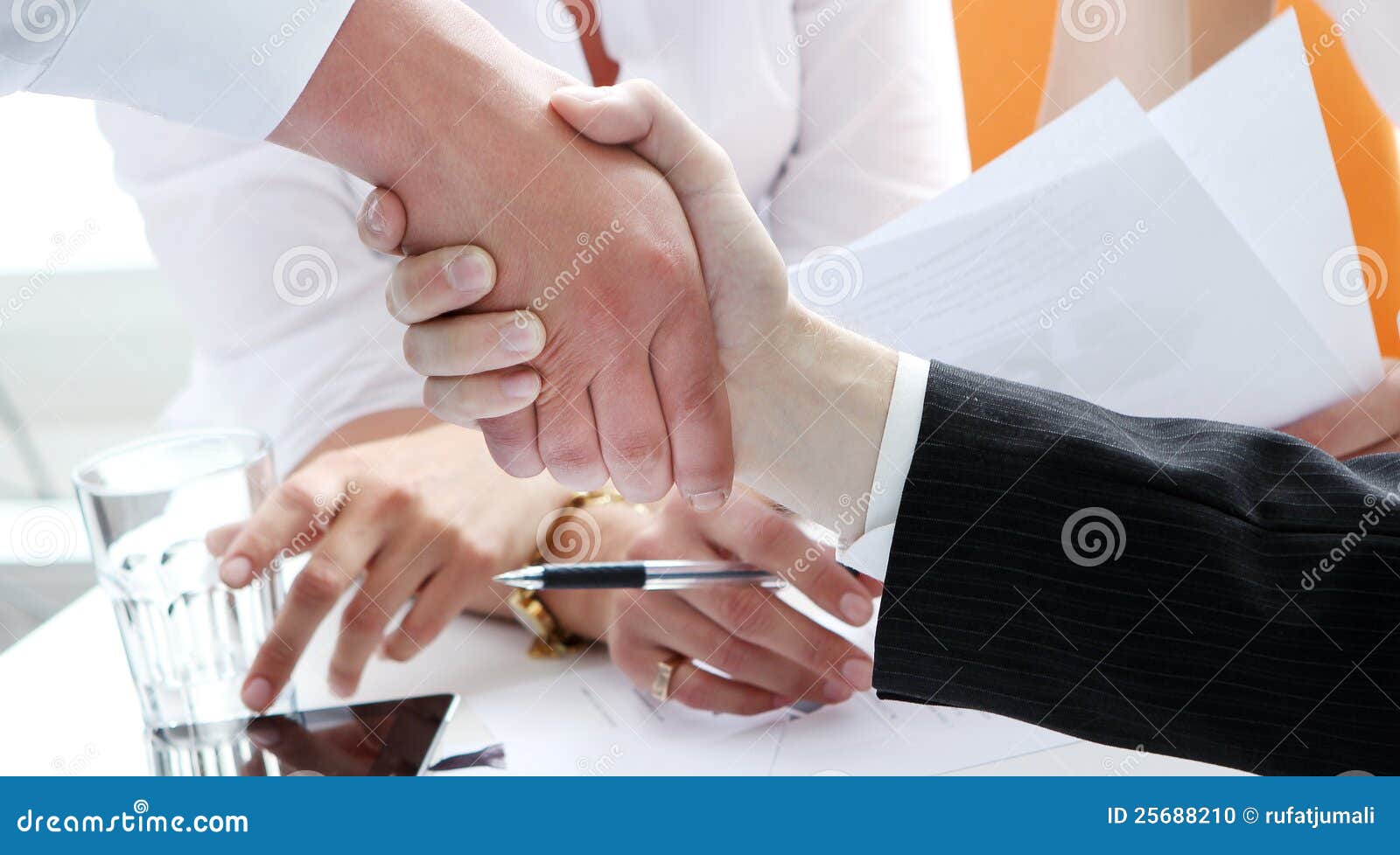 Two partners shaking hands stock photo. Image of contract - 25688210