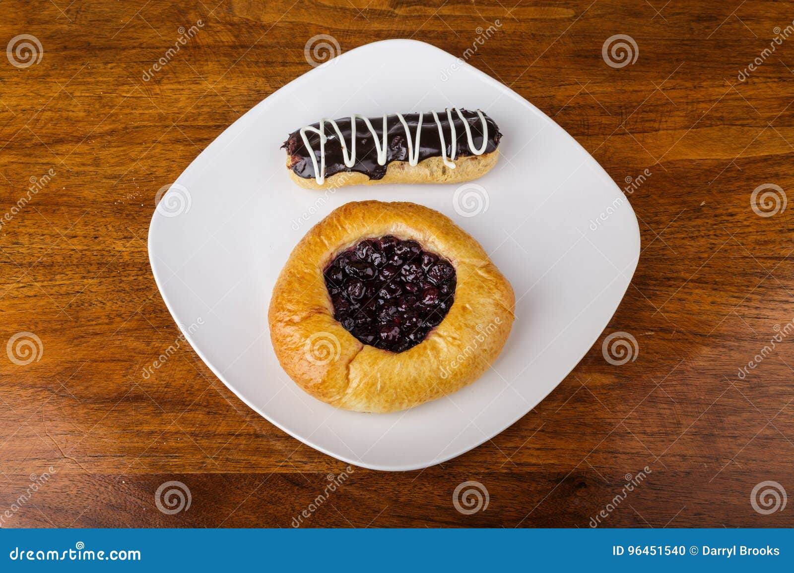Two Pastries on Square Plate Stock Photo - Image of white, blueberries ...