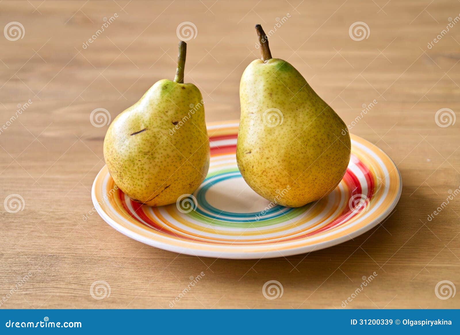 Two pears on color plate stock image. Image of vegeterian - 31200339