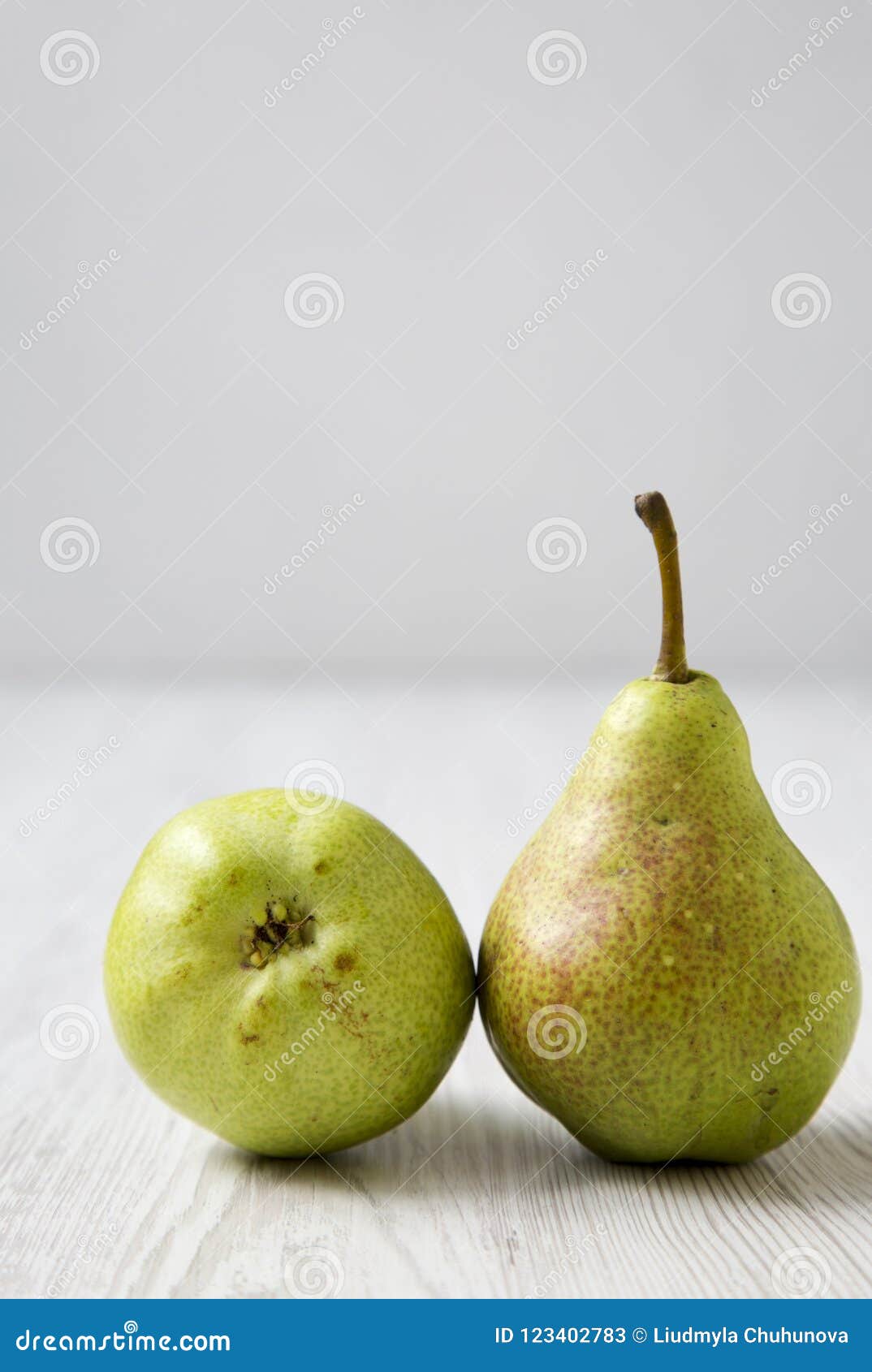 Two Pears on a White Wooden Table, Side View. Stock Image - Image of ...