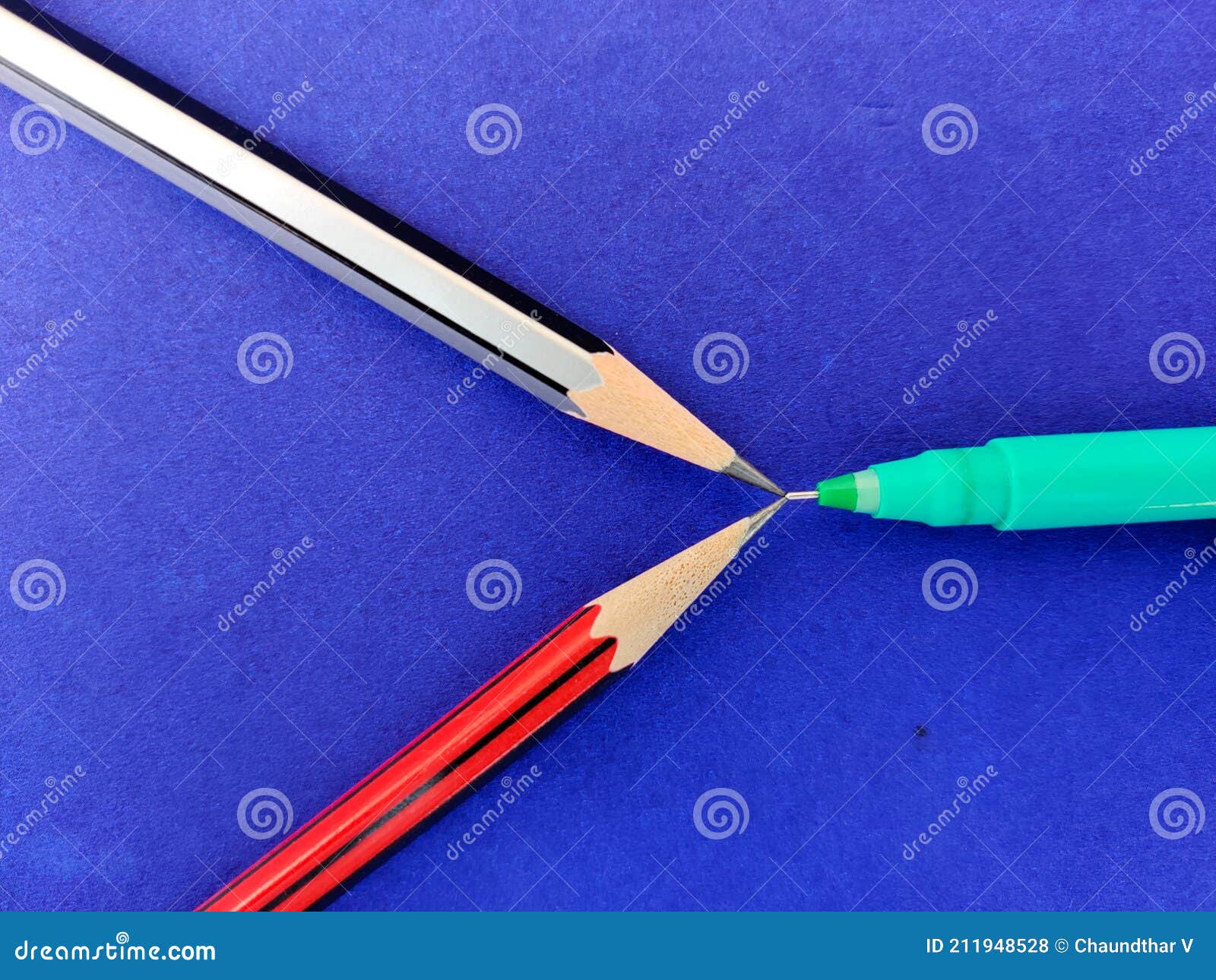 Two Pencil and Pen Pointing Each Other Stock Photo - Image of draw ...