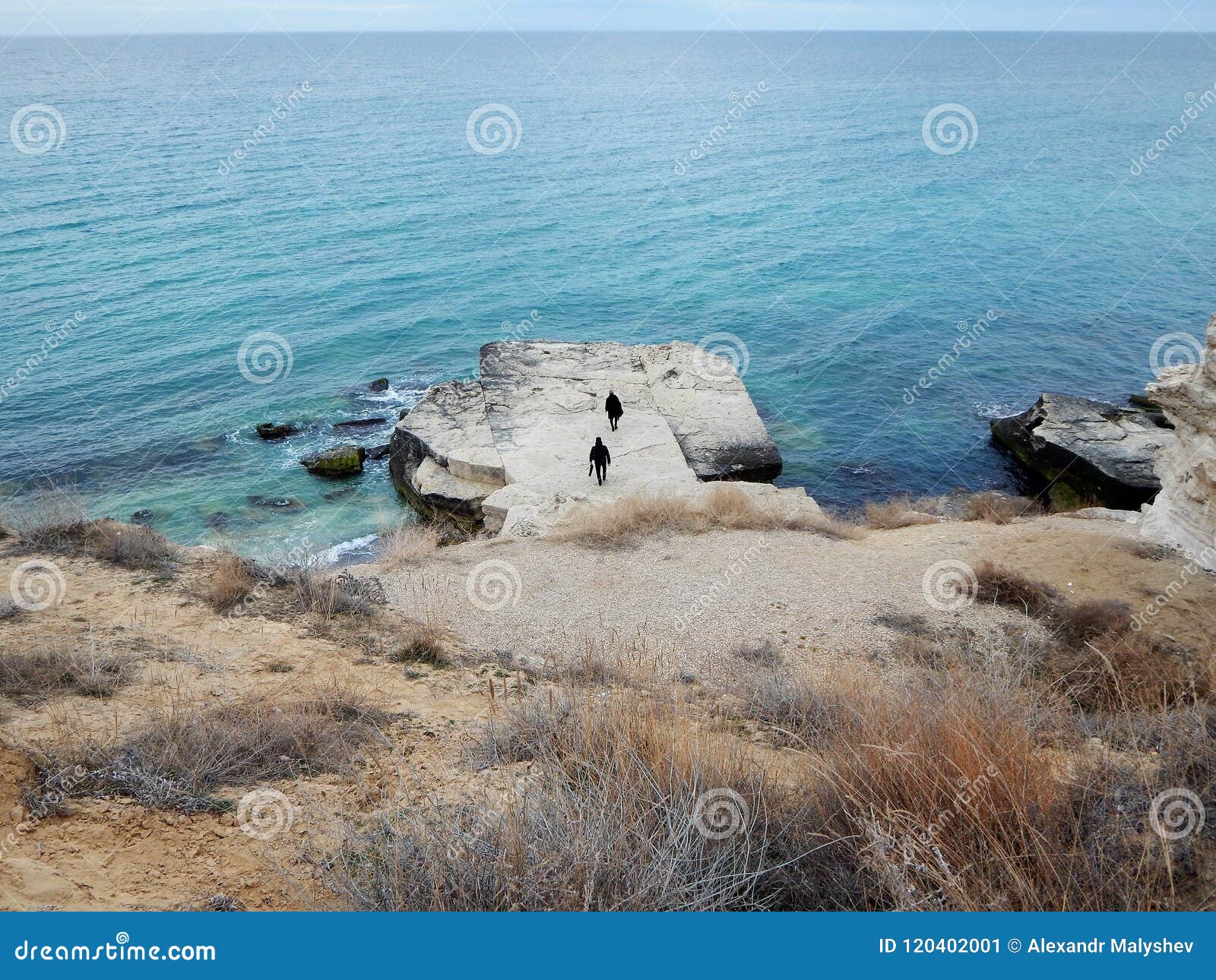 Two people on the beach. stock image. Image of stroll - 120402001