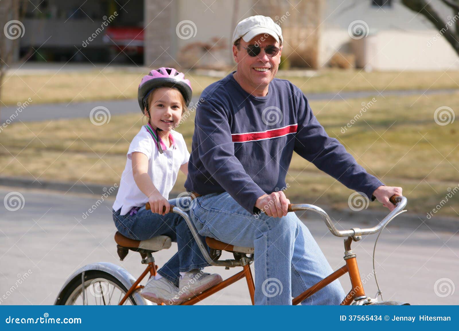 Two people on a bicycle stock photo. Image of riding - 37565434