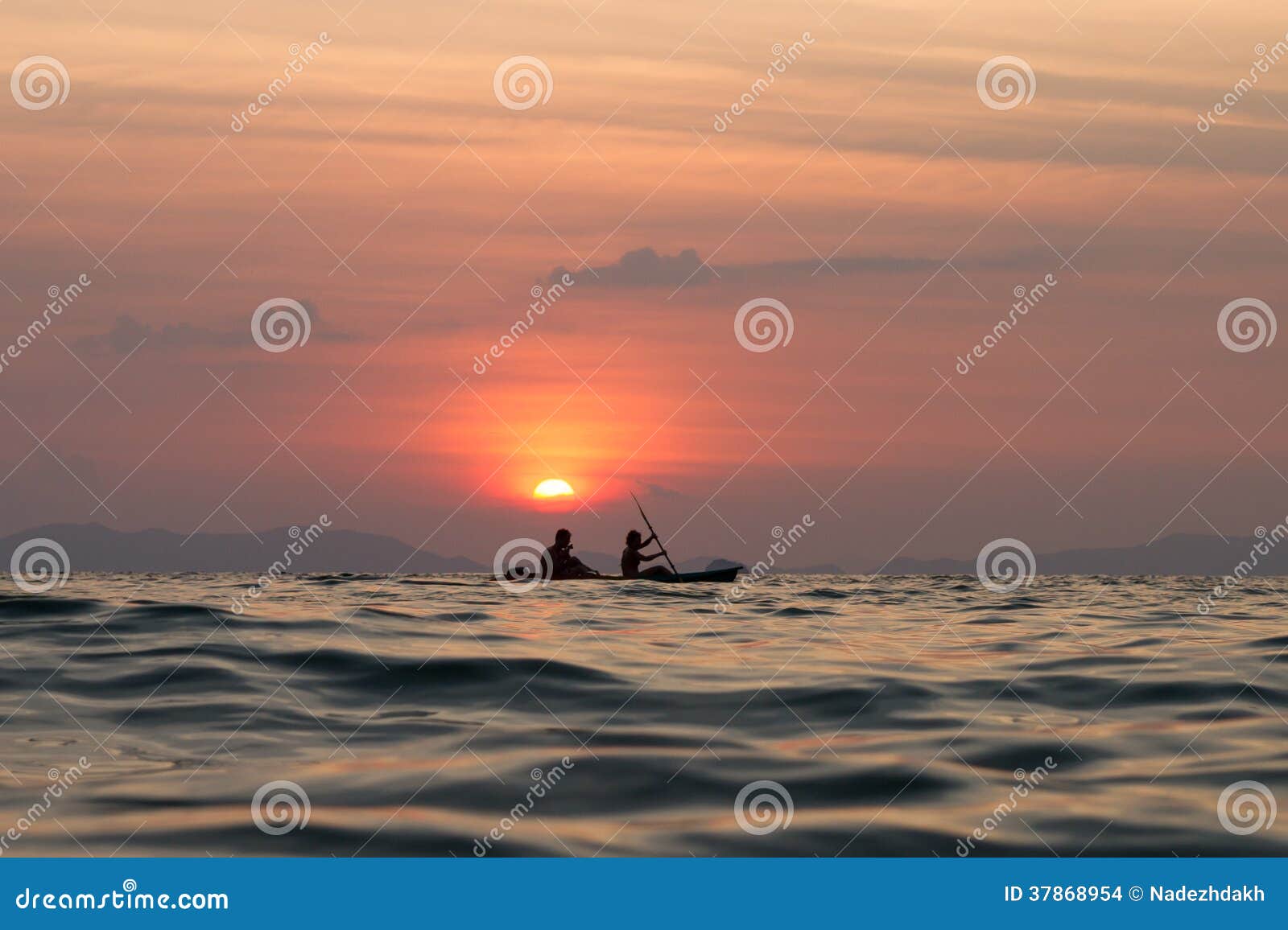 Two People in the Boat Against a Sunset Stock Photo - Image of warm ...