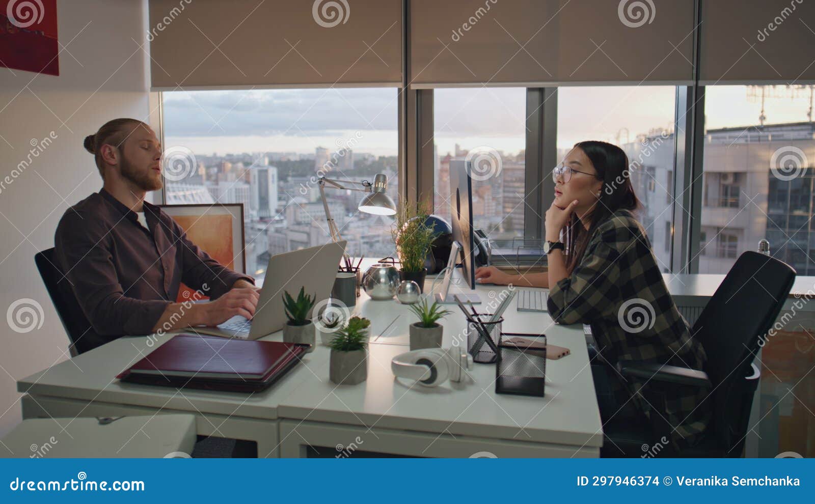 Two People Brainstorming at Sunset View Office Close Up. Colleagues ...