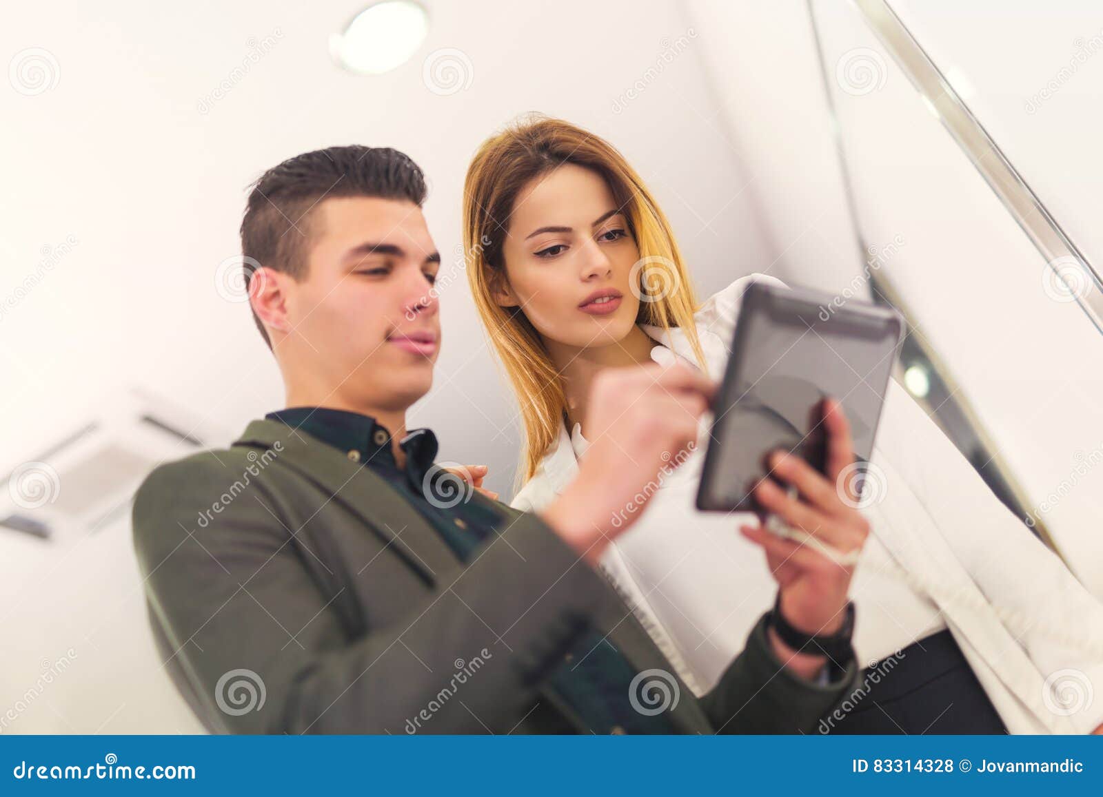 Two People are Choosing Digital Tablet Stock Photo - Image of cellphone ...