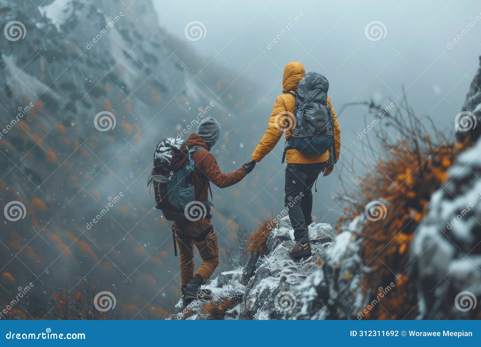 Two People are Climbing a Mountain Together Stock Photo - Image of ...
