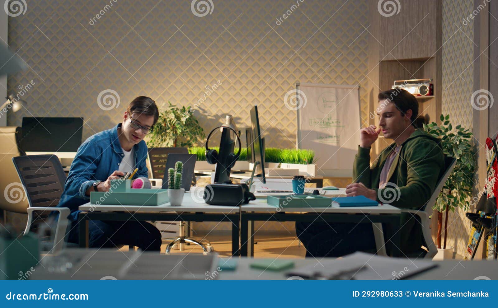 Two People Communicating Workplace Interior. Positive Man Drinking Tea ...