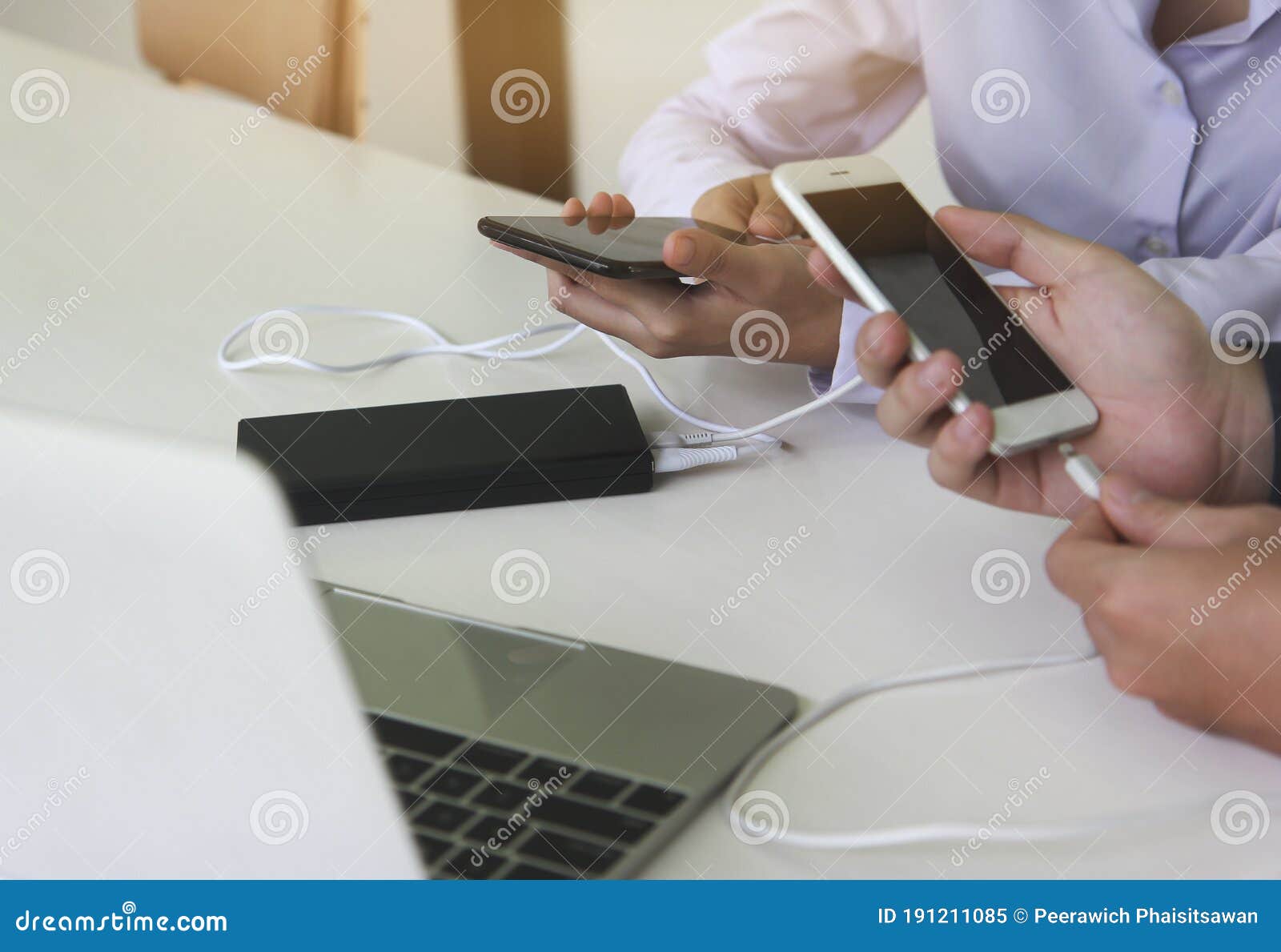 Two People Connecting the Mobile To a Power Bank.Technology Device ...