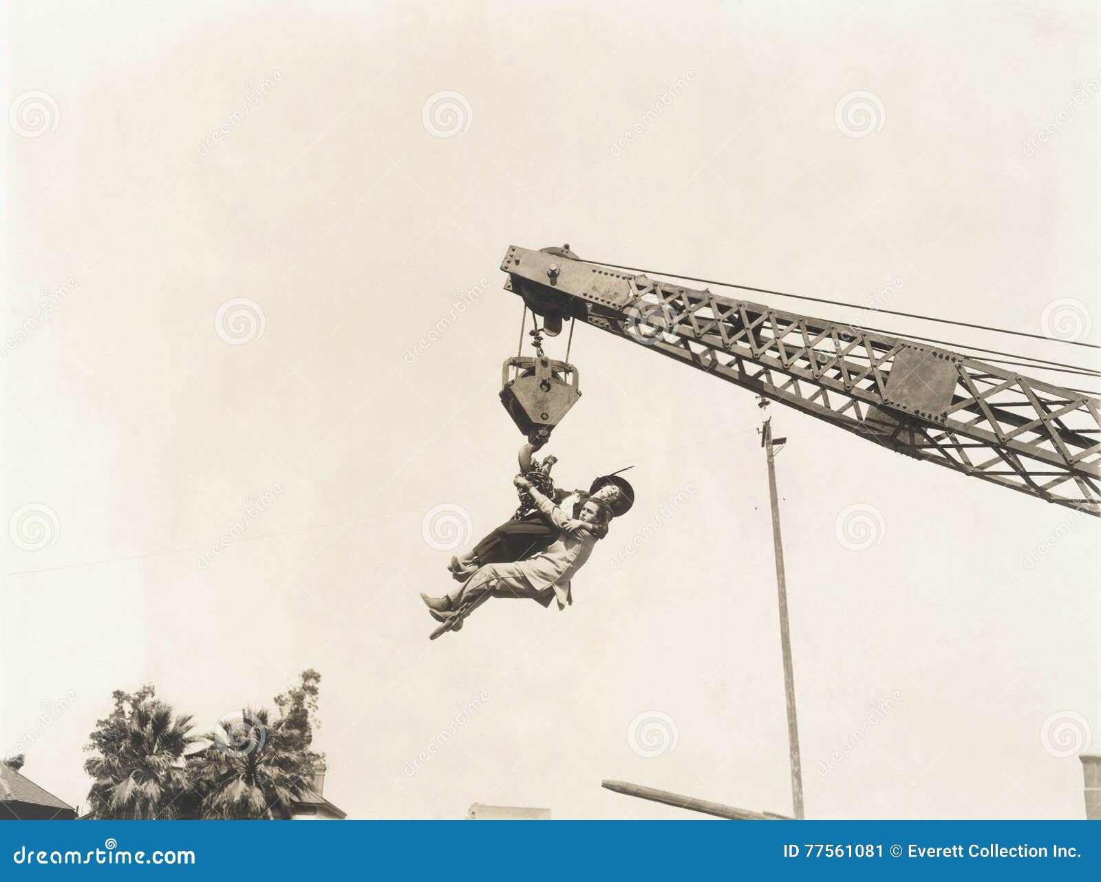 Two People Dangling from Crane Stock Image - Image of nostalgia ...