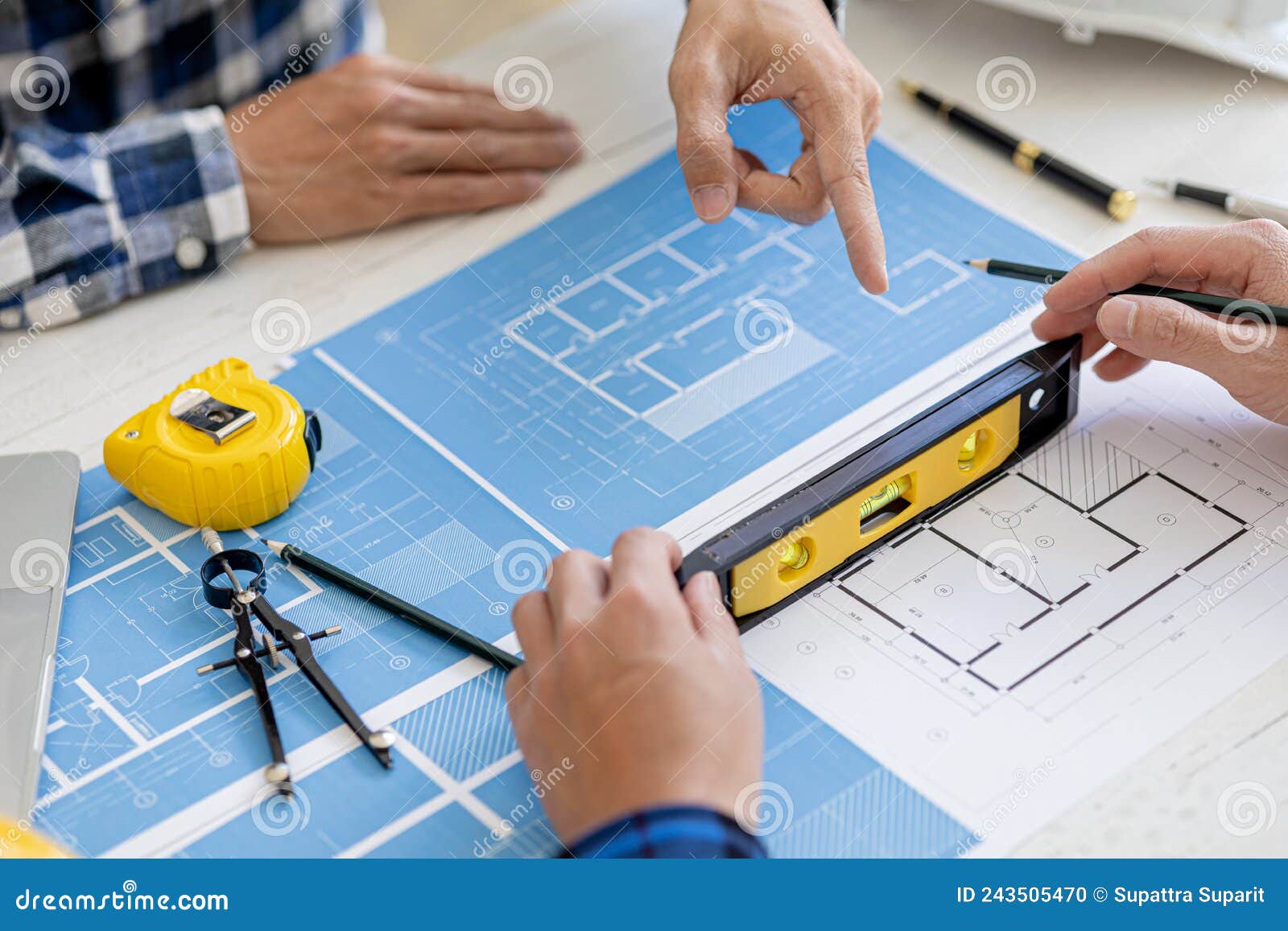 Two People are Discussing the Design of the Building Plan, the ... Two People are Discussing the Design of the Building Plan, the ...
