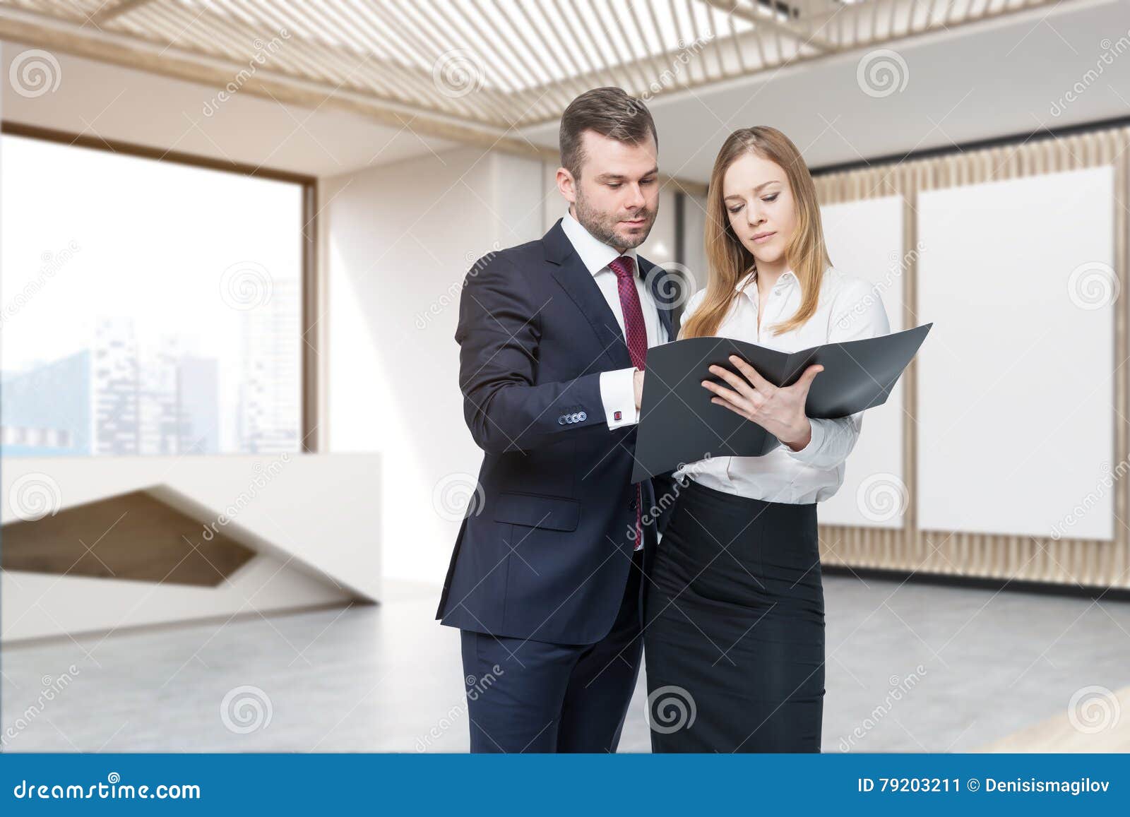 Two People Discussing Work Issues in Office Lobby Stock Image - Image ...