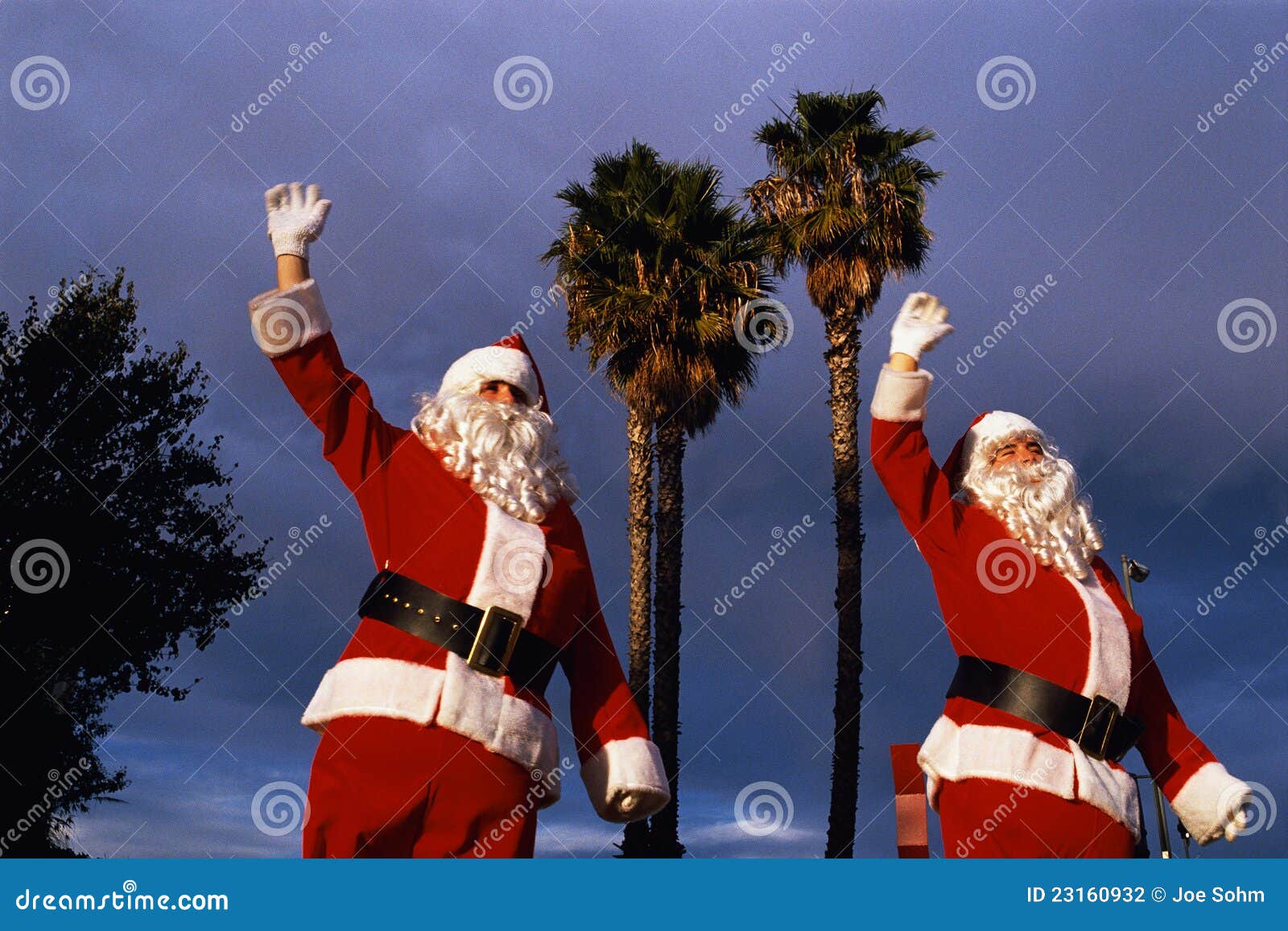 Two People Dressed As Santa Editorial Photography - Image of joyous ...
