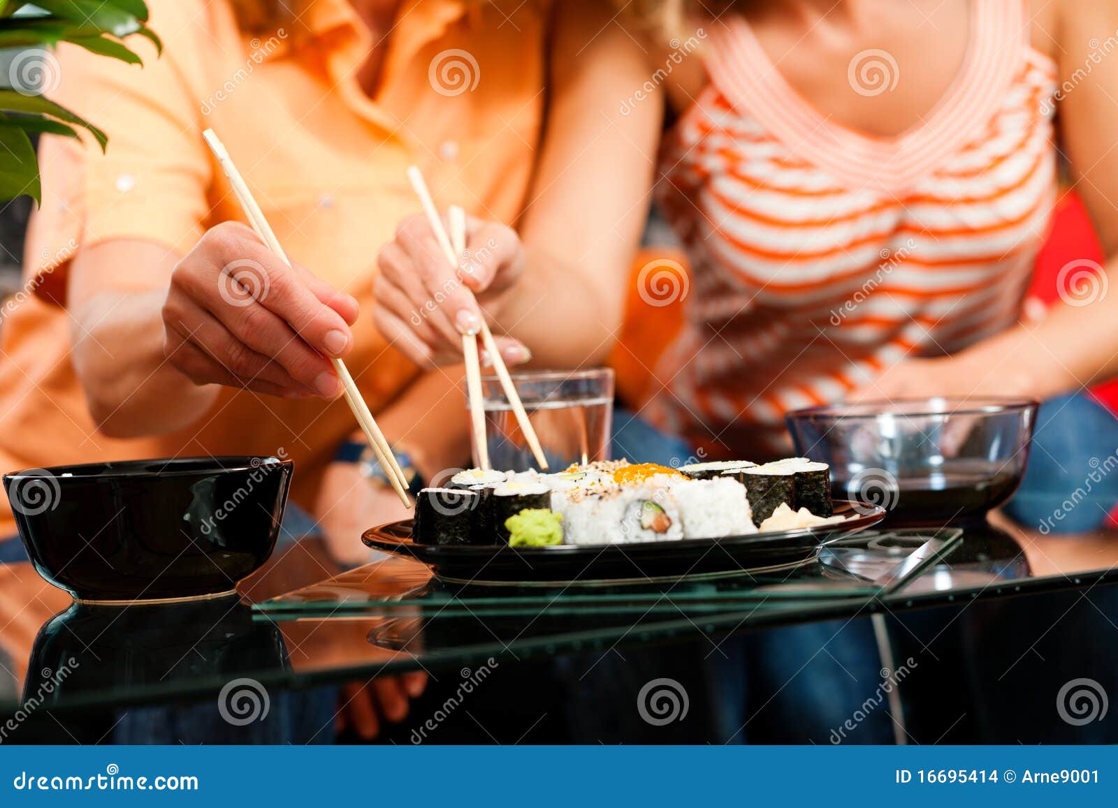 Two People Eating Sushi Stock Images - Image: 16695414