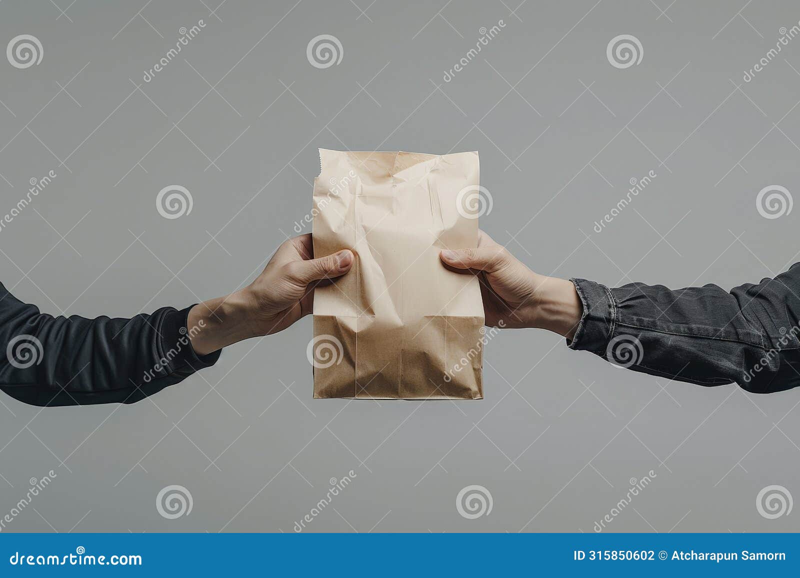 Two People are Exchanging a Brown Paper Bag, Mockup on the Paper Bag ...