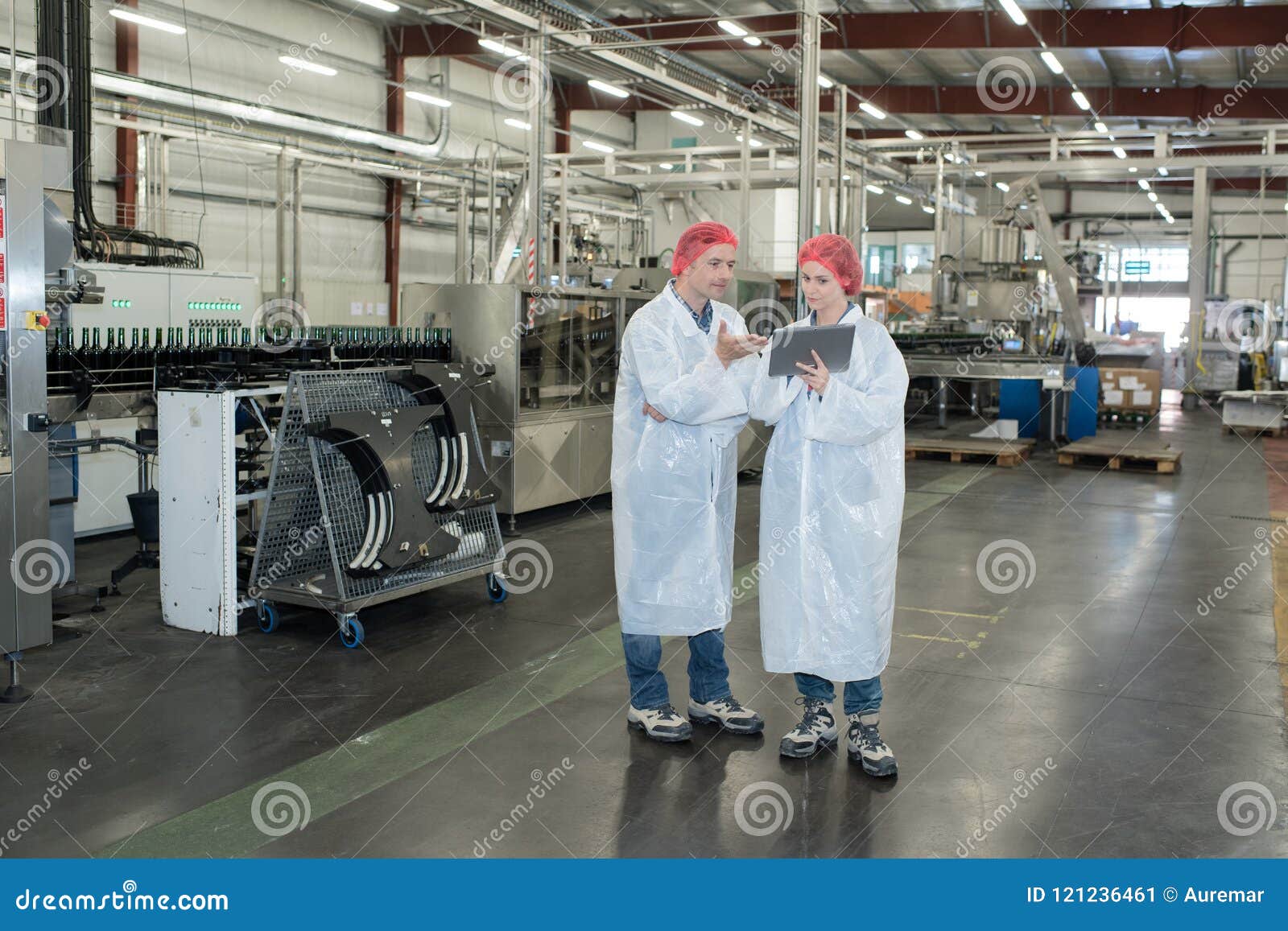 Two people in factory stock image. Image of computer - 121236461