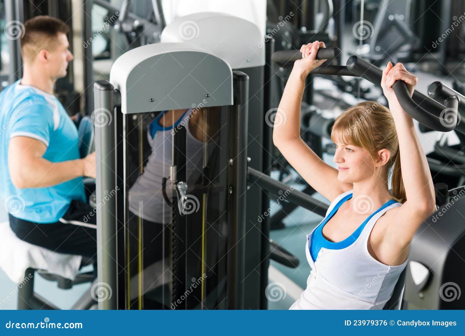 Two People at Fitness Center Exercise Machine Stock Photo - Image of ...