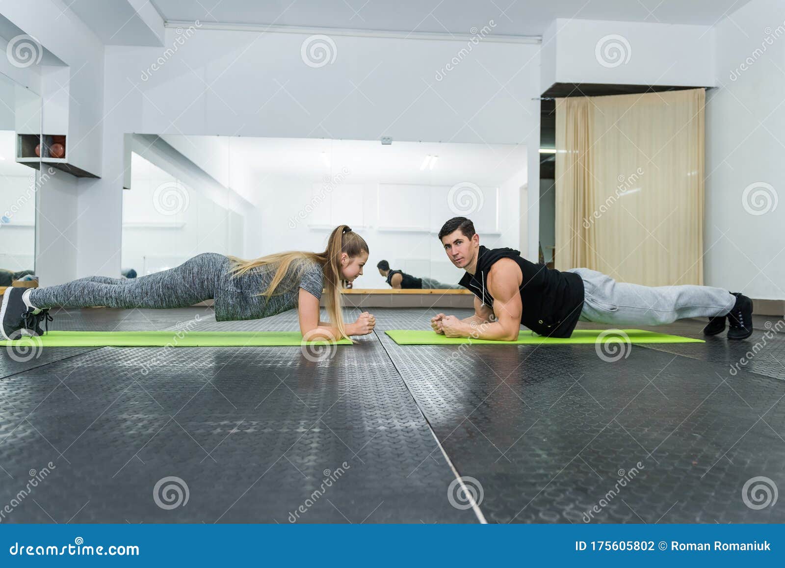 Two People in Gym Doing Plank Exercise Together Stock Photo - Image of ...