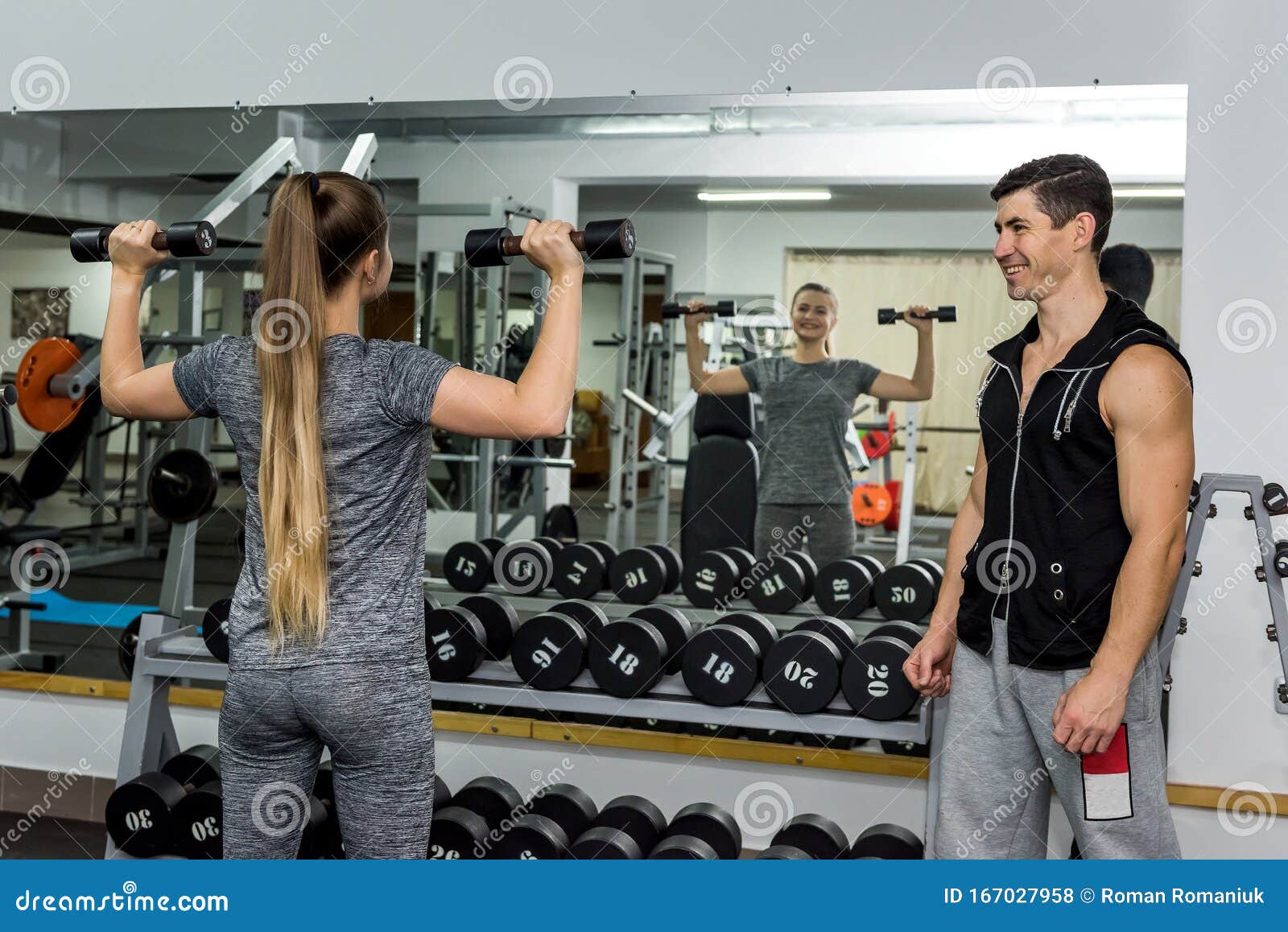 Two People in Gym Making Exercise Together Stock Photo - Image of ...