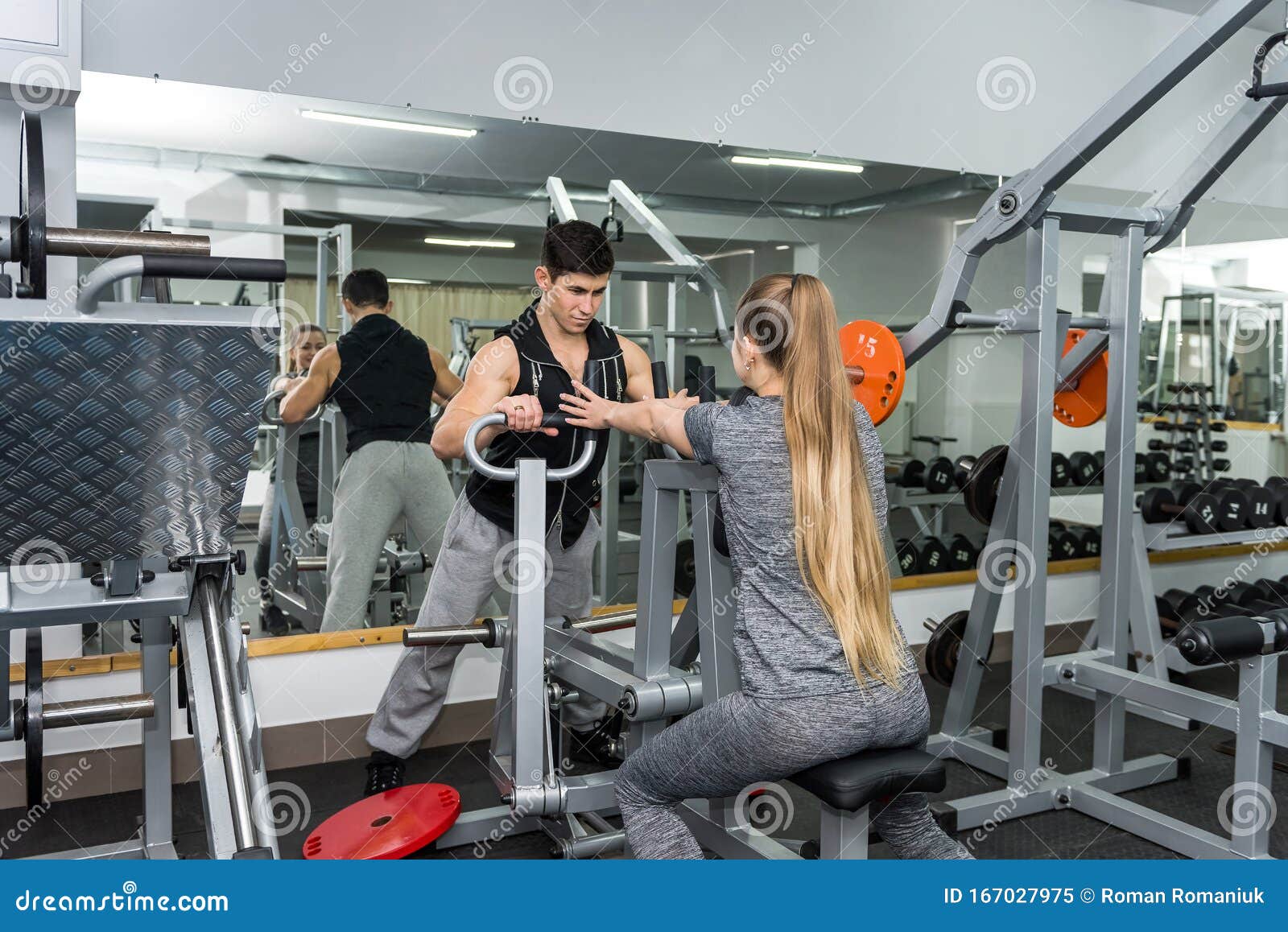 Two People in Gym Making Exercise Together Stock Image - Image of ...