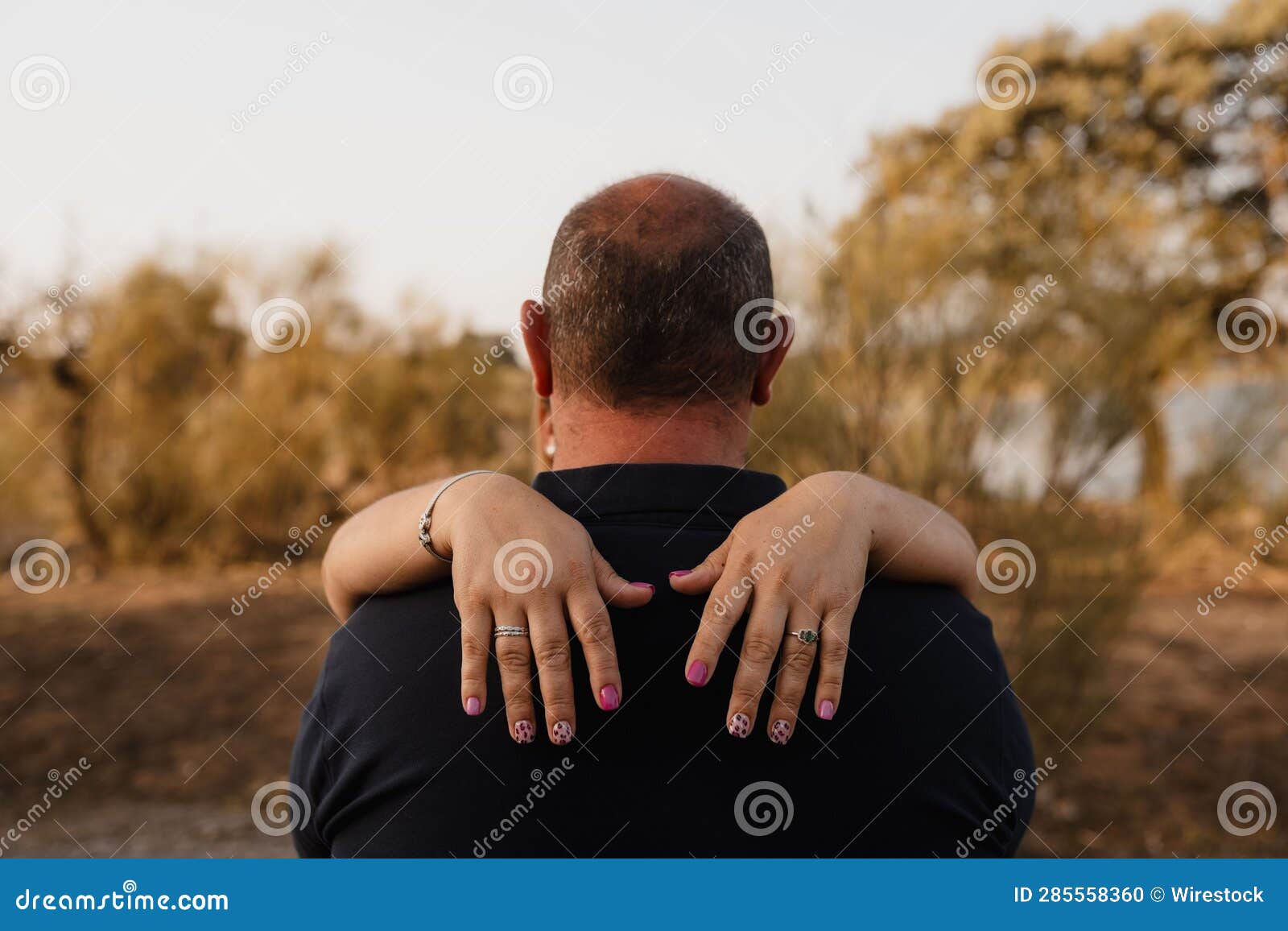 Two People with Hand on Each Other S Shoulders Facing Away from Camera ...