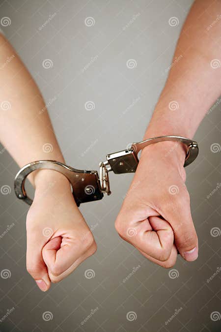 Two People Handcuffed Together Stock Photo - Image of pair, prisoner ...