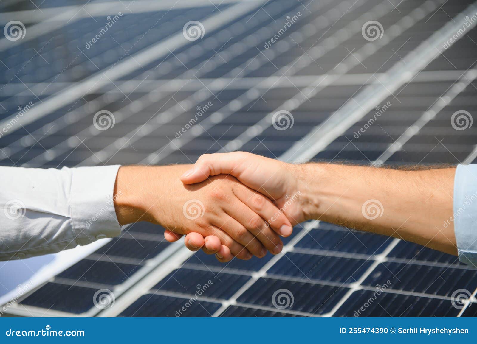 Two People Having a Shaking Hands Against Solar Panel after the ...