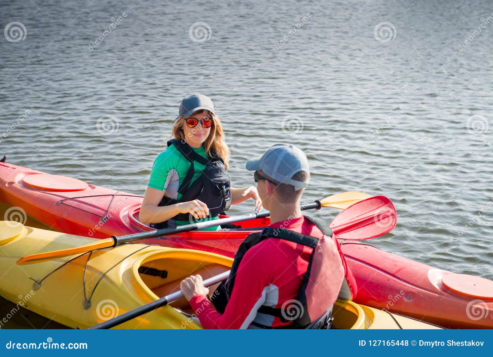 Two People in Kayaks on the River Stock Photo - Image of canoeing ...