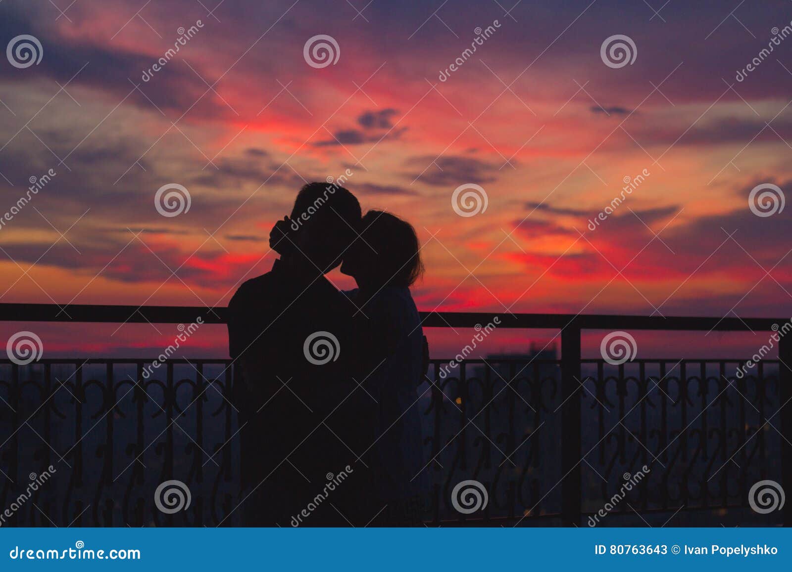 Two people kissing stock image. Image of sunset, love - 80763643
