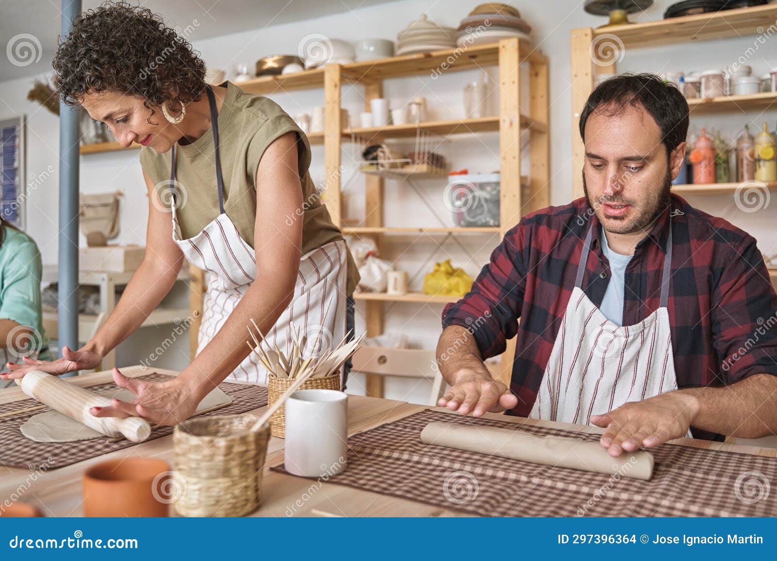Two People Kneading and Shaping Clay in a Pottery Workshop. Stock Photo ...