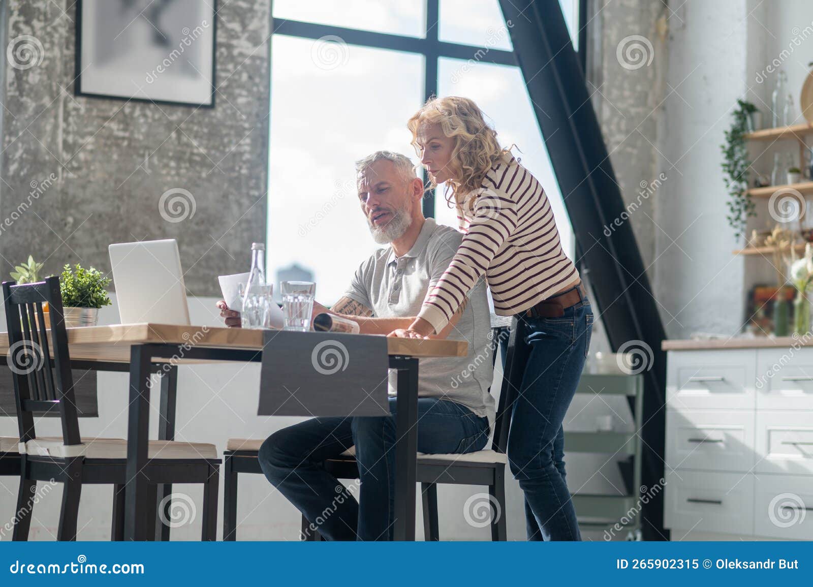 Two People at the Laptop Looking Involved and Discussing Something ...