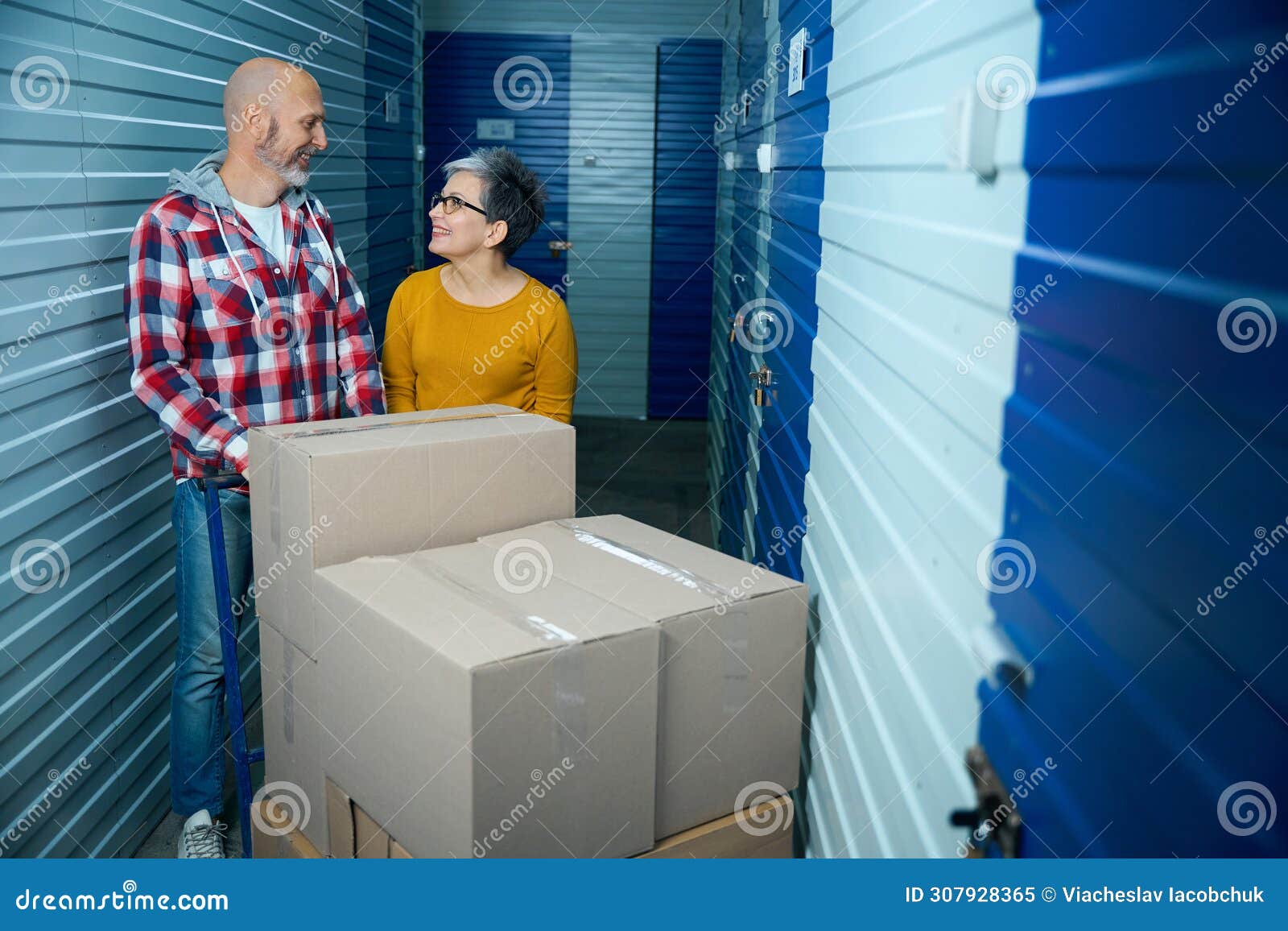 Two People Look at Each Other while Transporting Things Stock Image ...