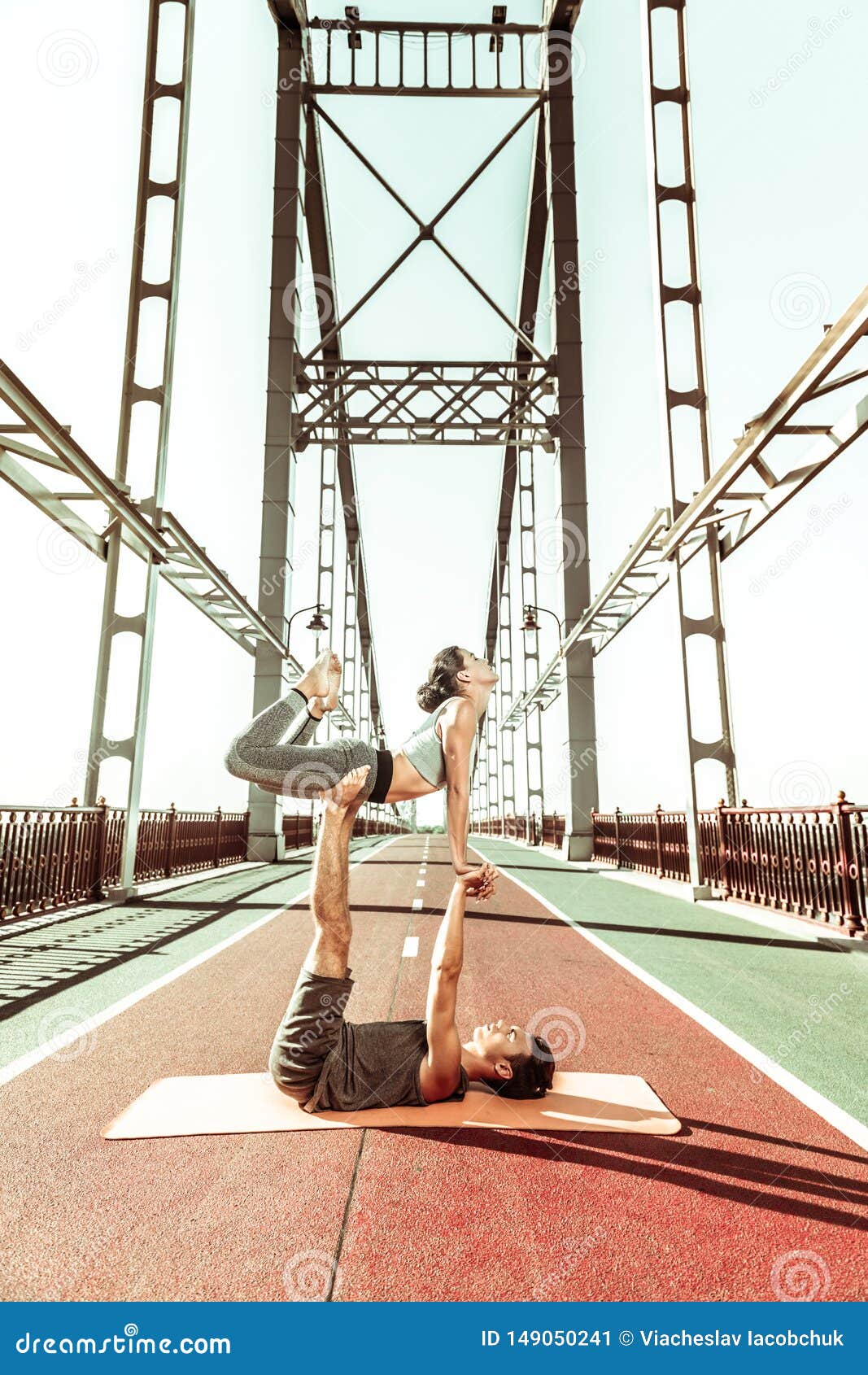 Two People Performing Acrobatic Activities Under a Summer Sky Stock ...