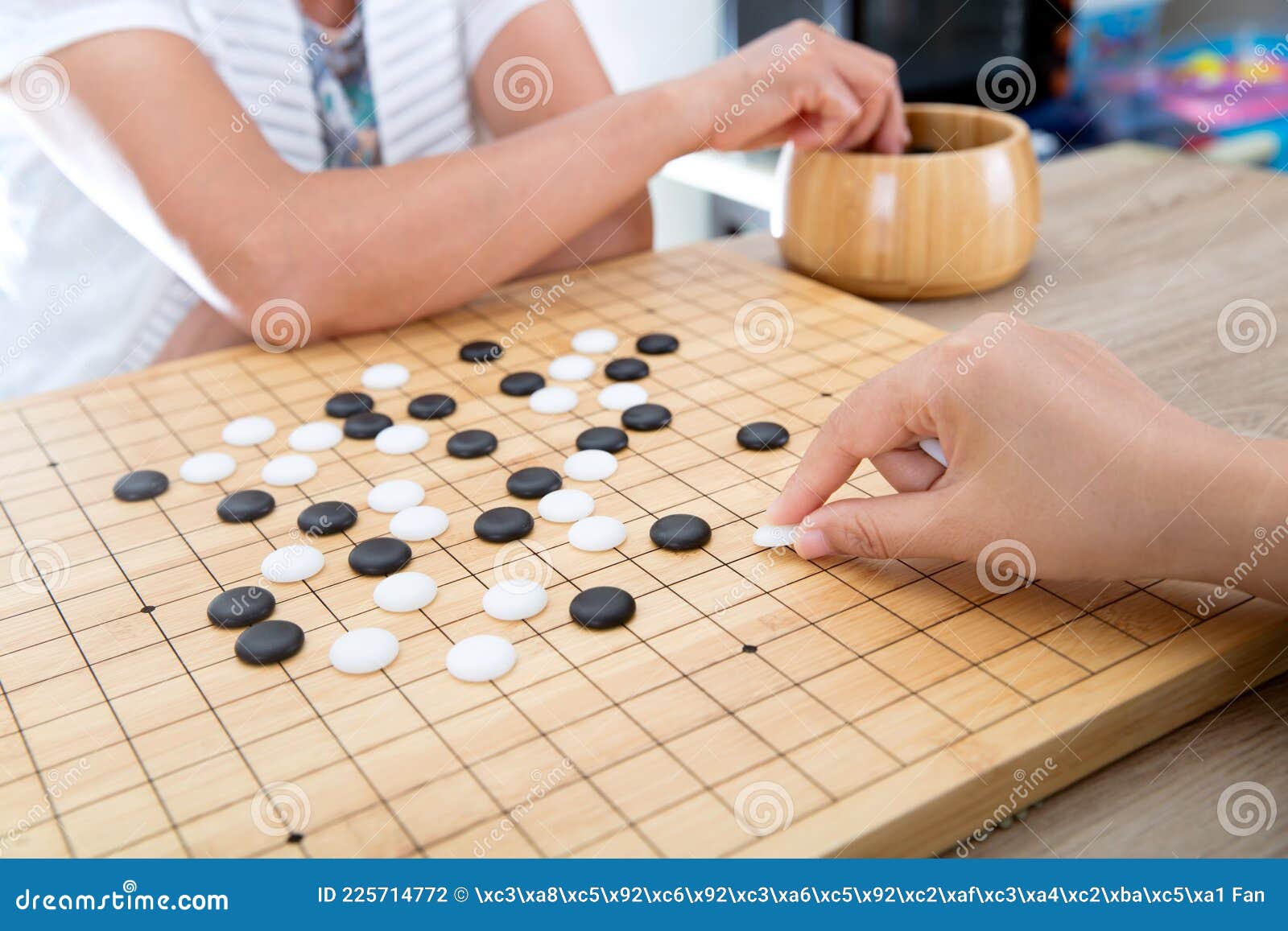 Two People Playing Traditional Chinese Go Game Stock Photo - Image of ...