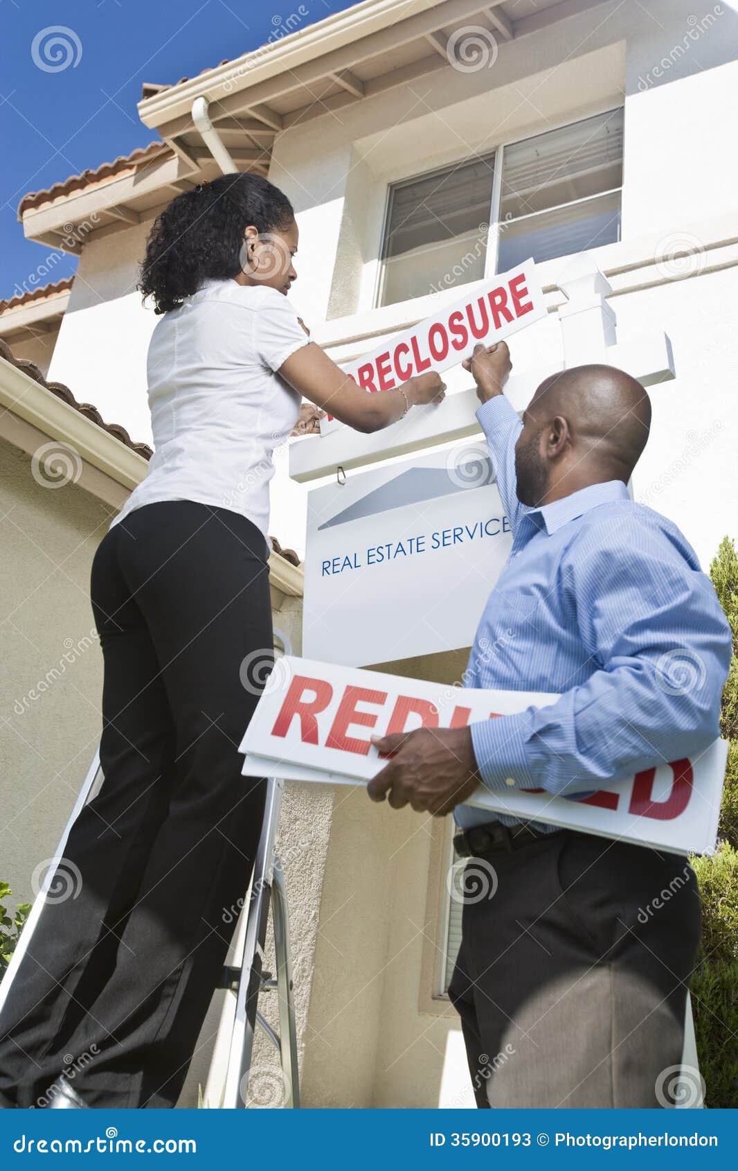 Two People Putting Up Notice Outside House Stock Image - Image of ...