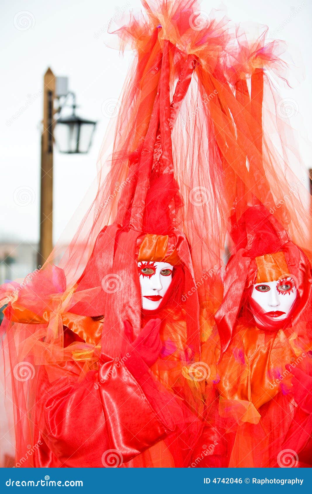 Two people in red costumes stock photo. Image of decoration - 4742046
