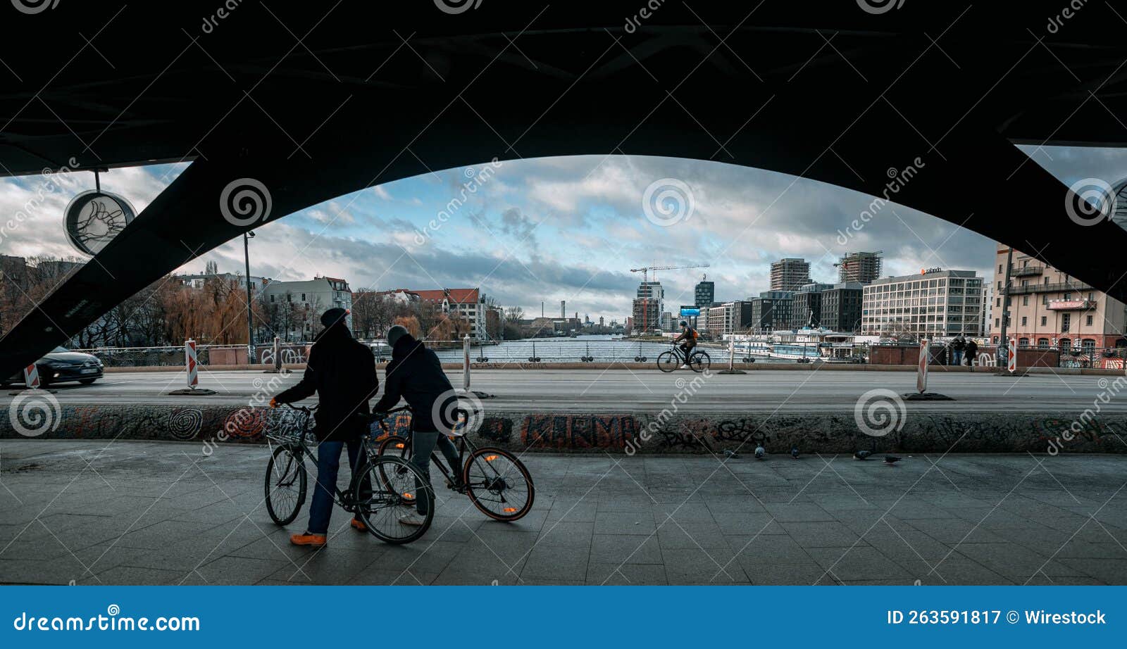 Two People Riding Bicycle Under the Bridge Editorial Photography ...