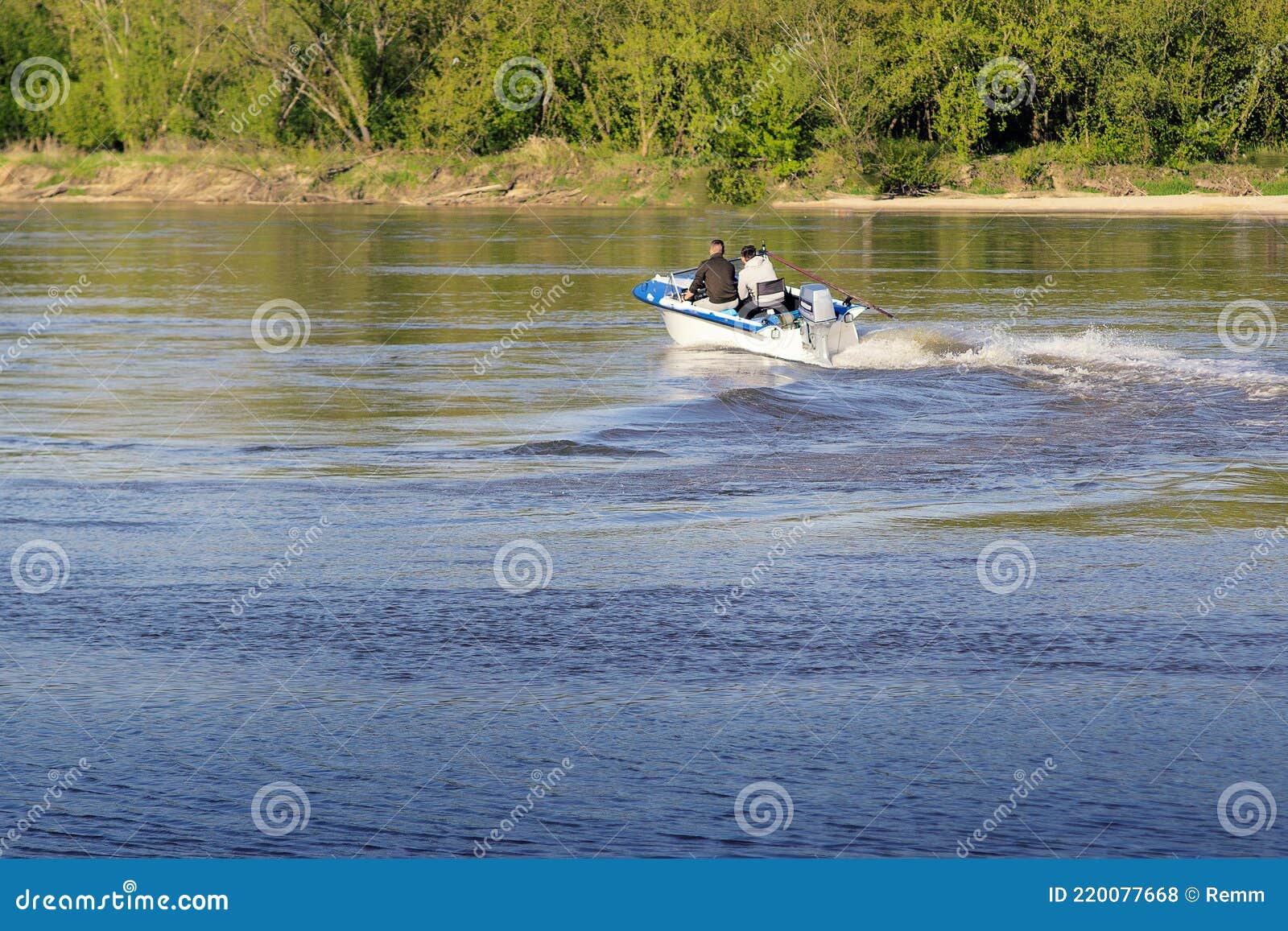 Two People are Riding a Motorboat on the River Stock Photo - Image of ...