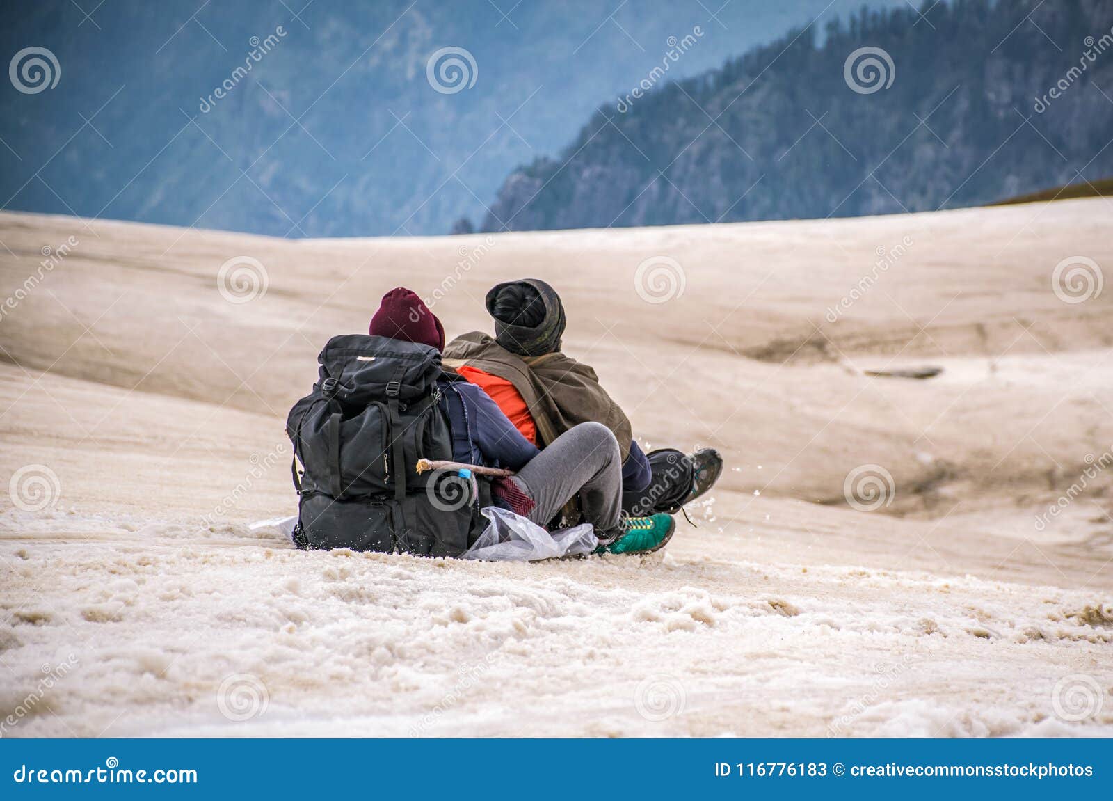 Two People Riding In Sled On Snow Picture. Image: 116776183
