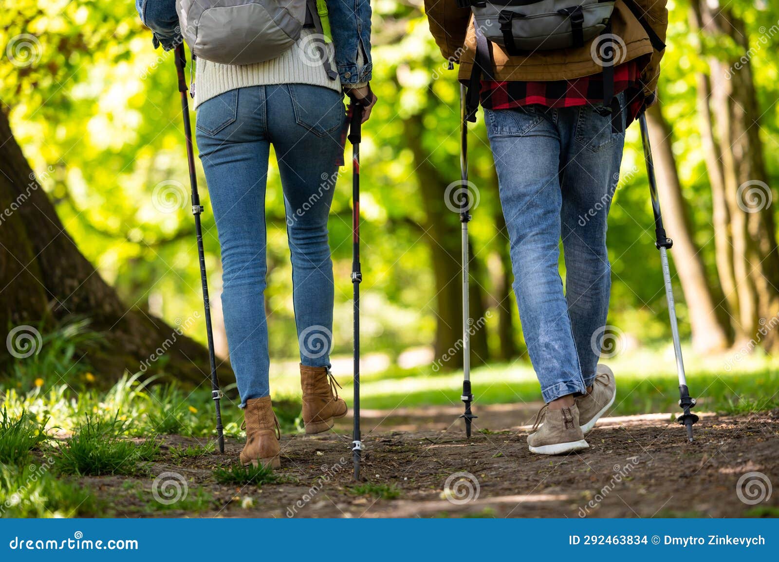 Two People on the Road in the Forest with Scandinavian Sticks Stock ...