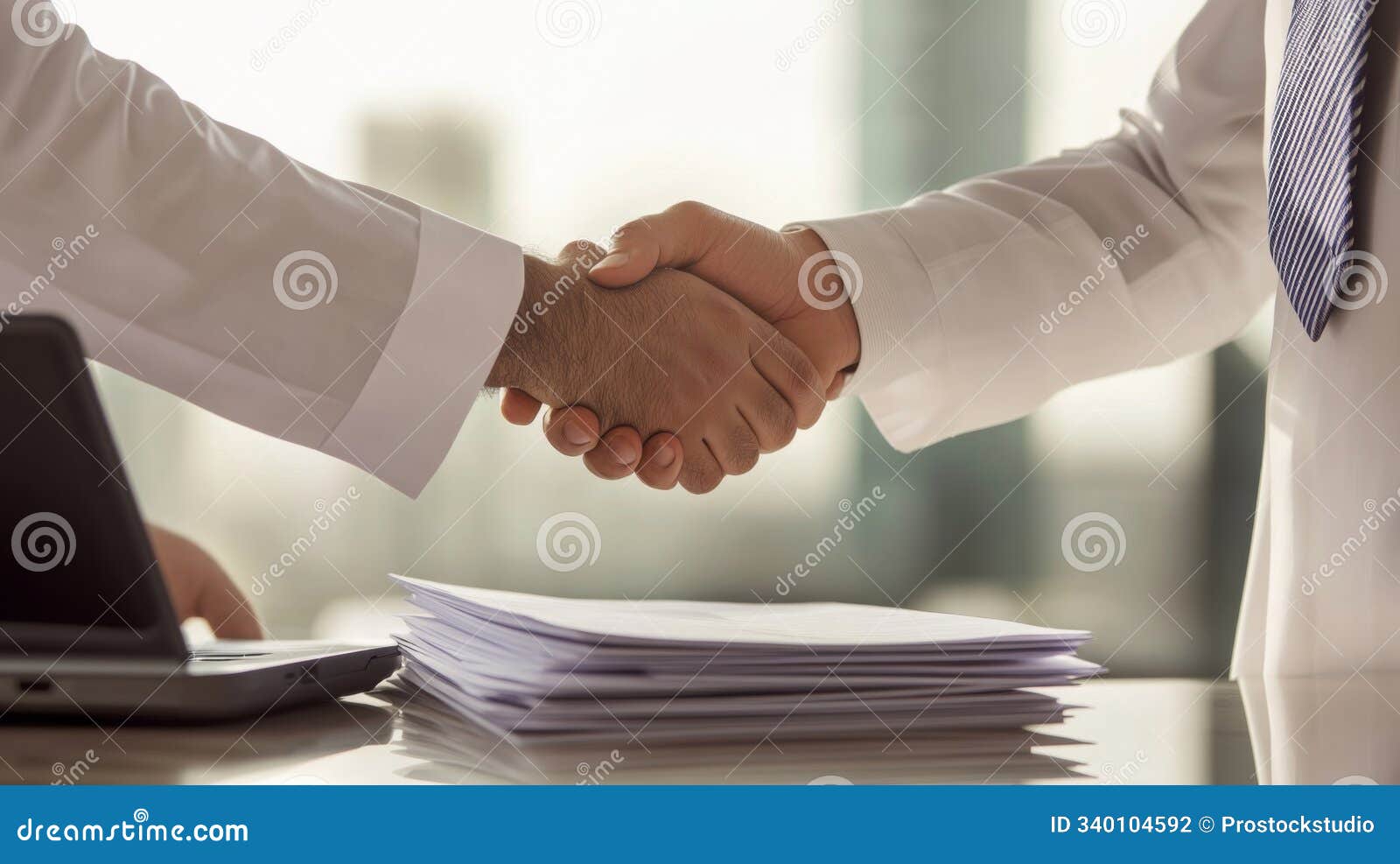 Two People Shake Hands in an Office Setting after a Meeting Stock Photo ...