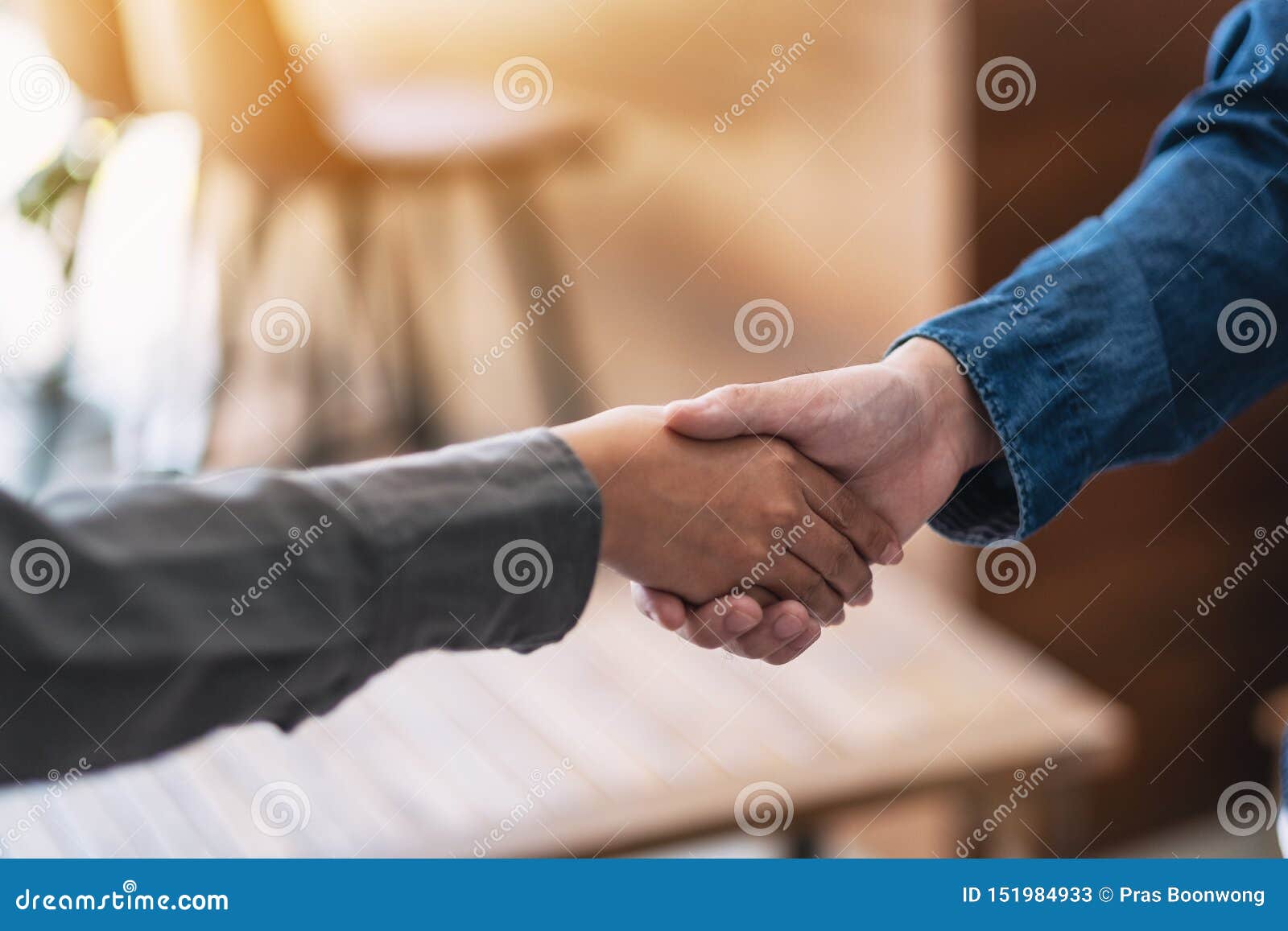 Two people shaking hands stock image. Image of hand - 151984933