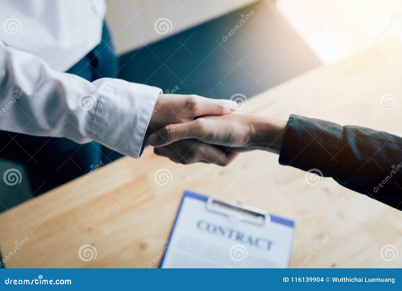 Two People Shaking Hands with Making a Contract in the Office. Stock ...