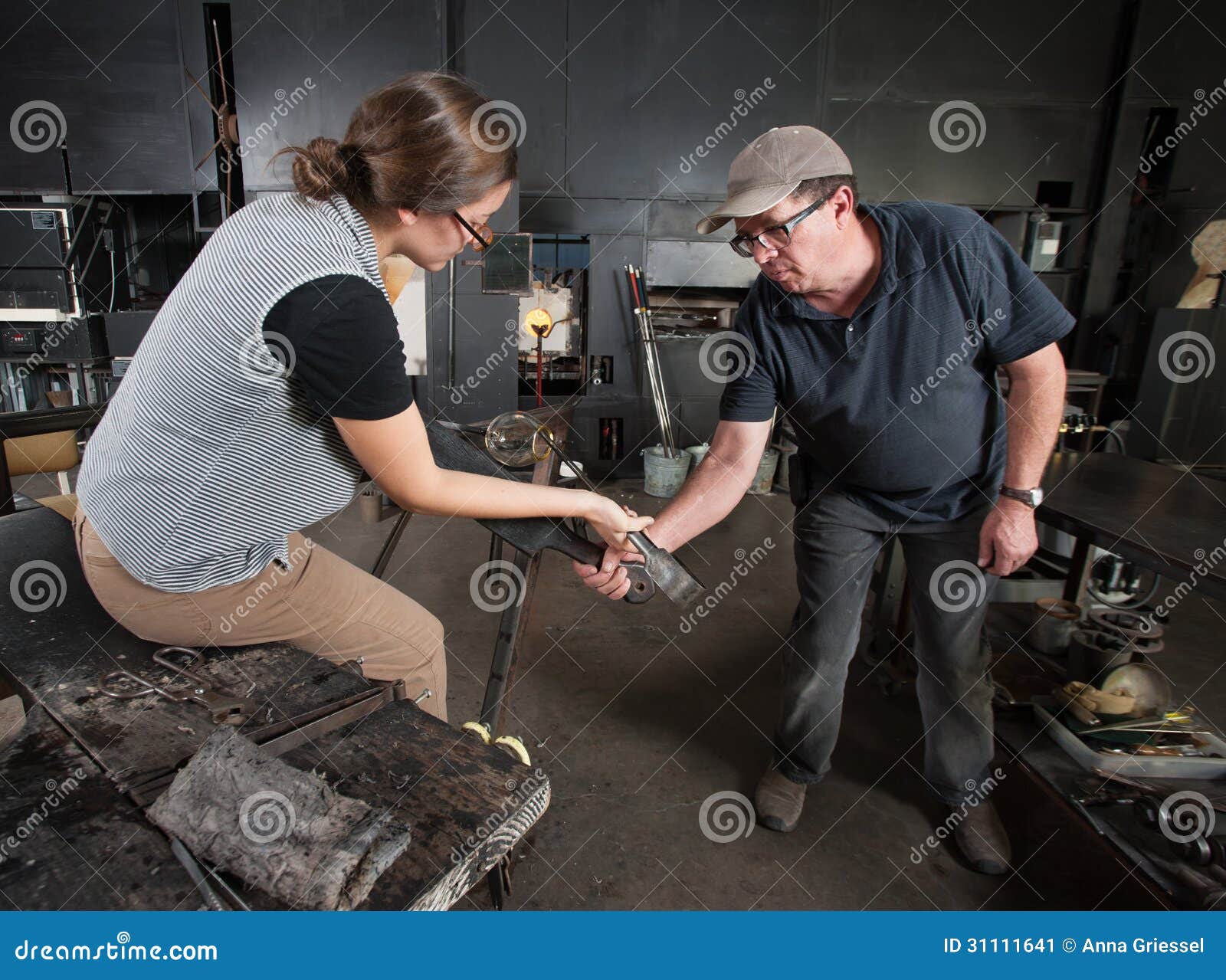 Two People Shaping Glass stock image. Image of company - 31111641