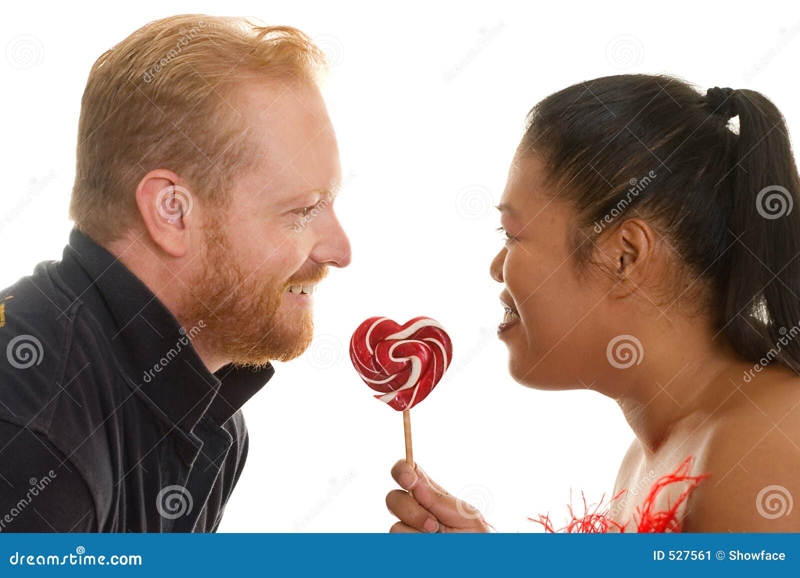 Two people share a candy stock image. Image of sharing - 527561