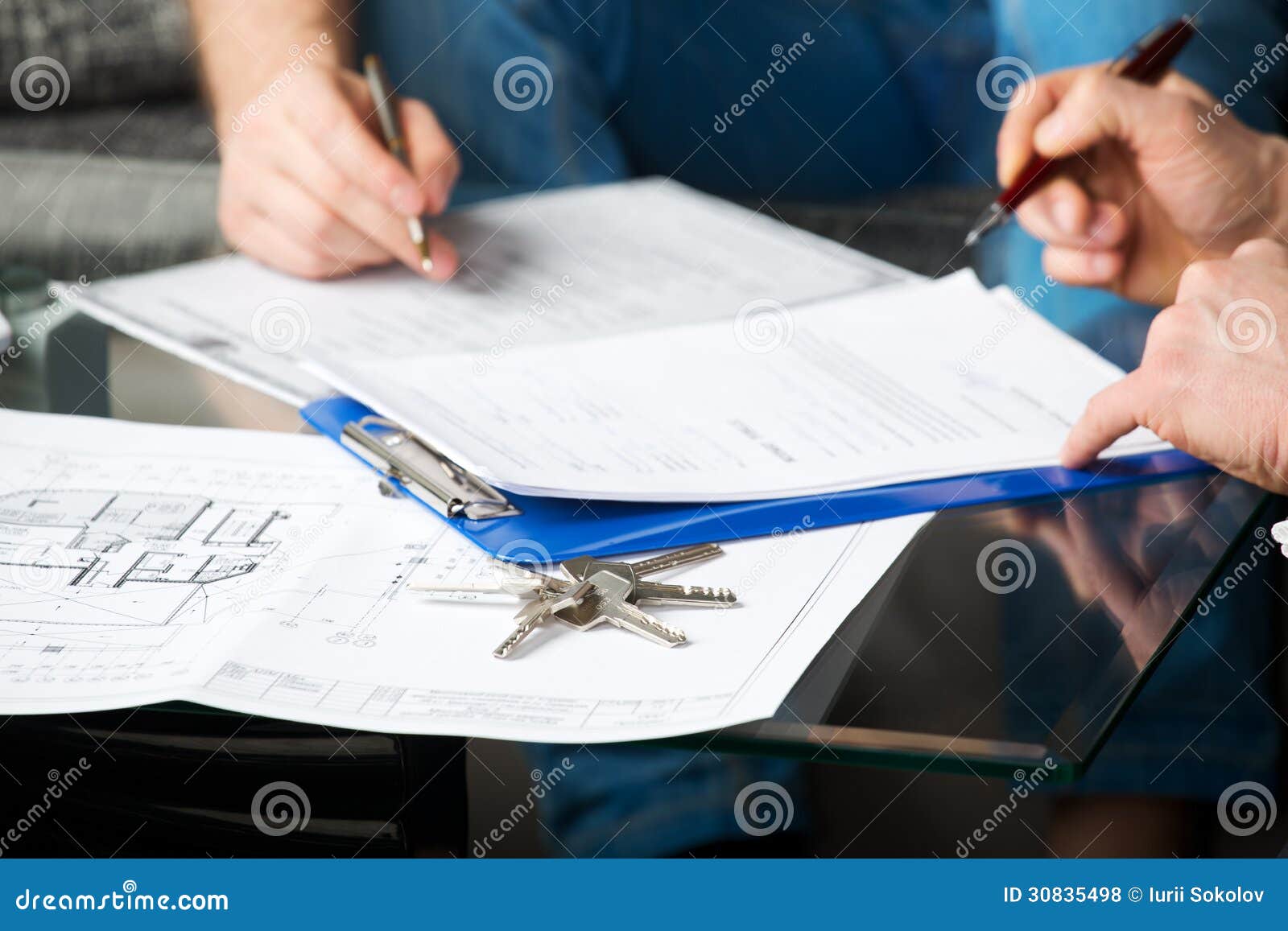 Two People Signing a Document Stock Photo - Image of form, paper: 30835498