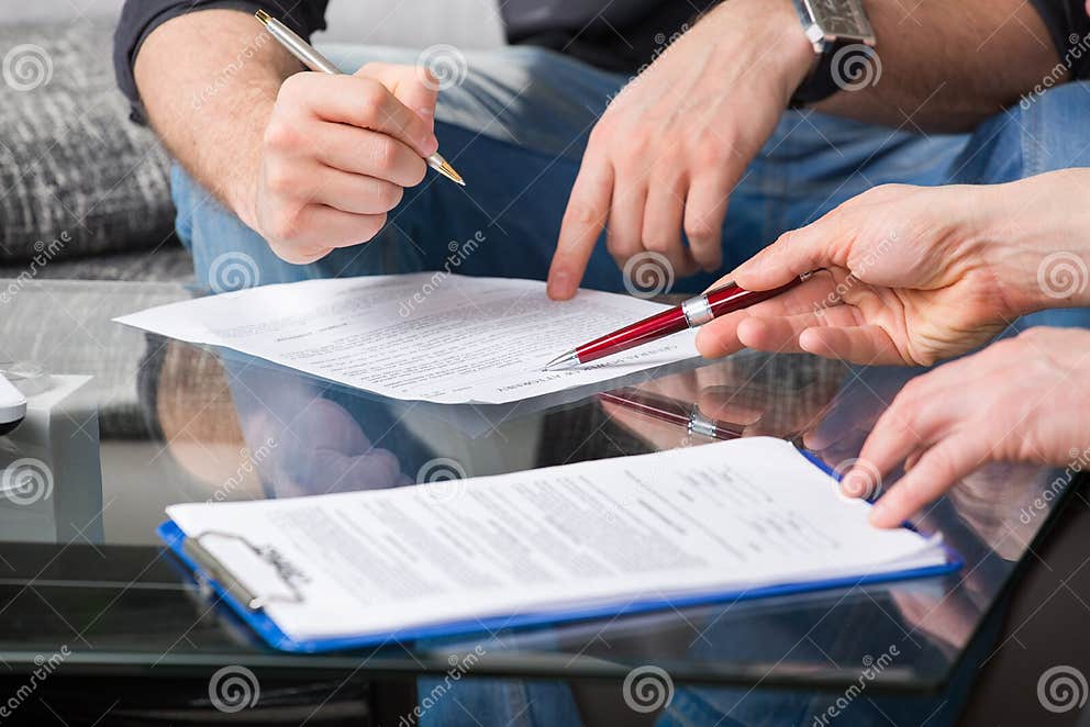 Two People Signing a Document Stock Image - Image of handwriting ...